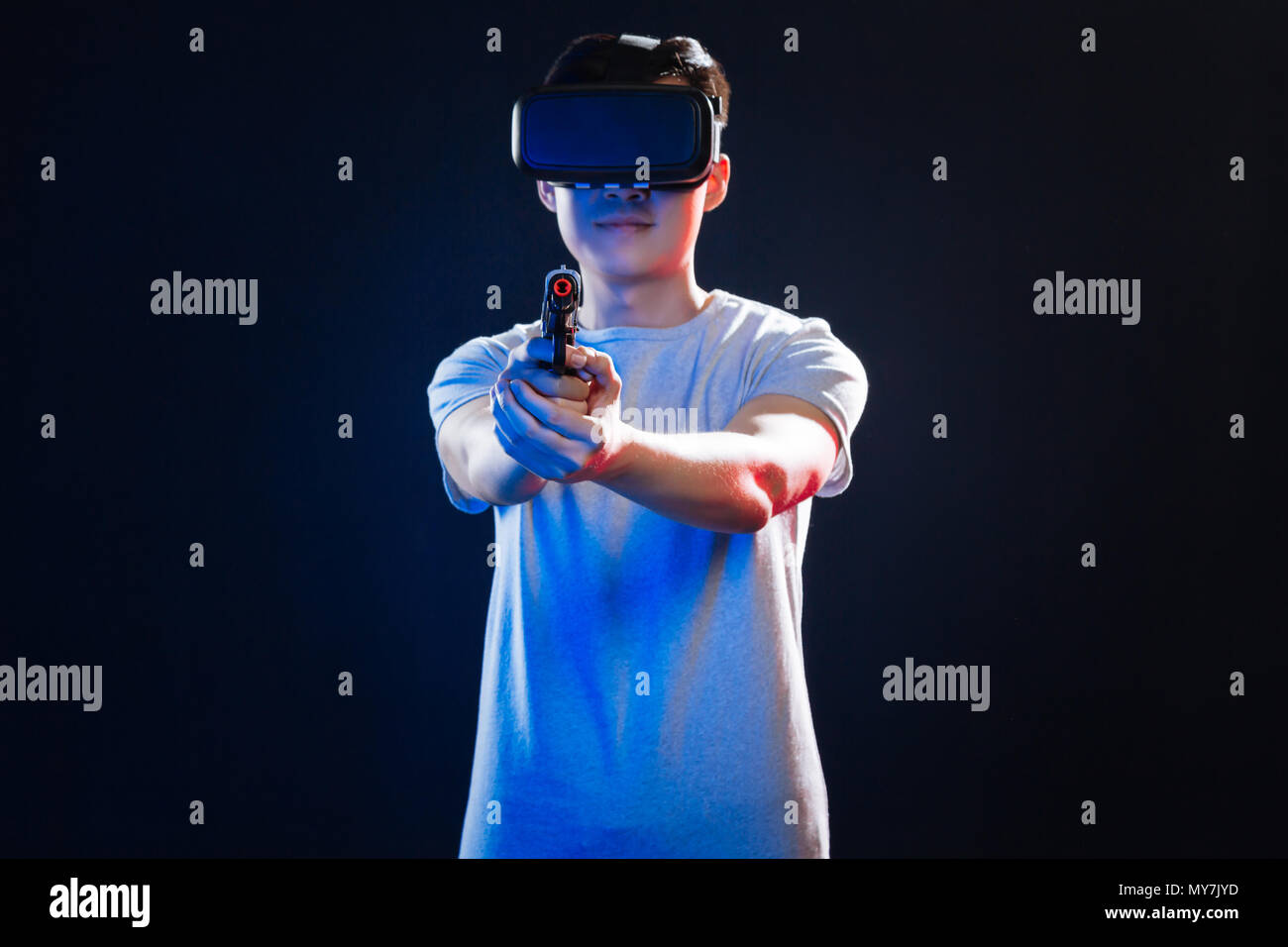 Smart nice man aiming at you Stock Photo - Alamy
