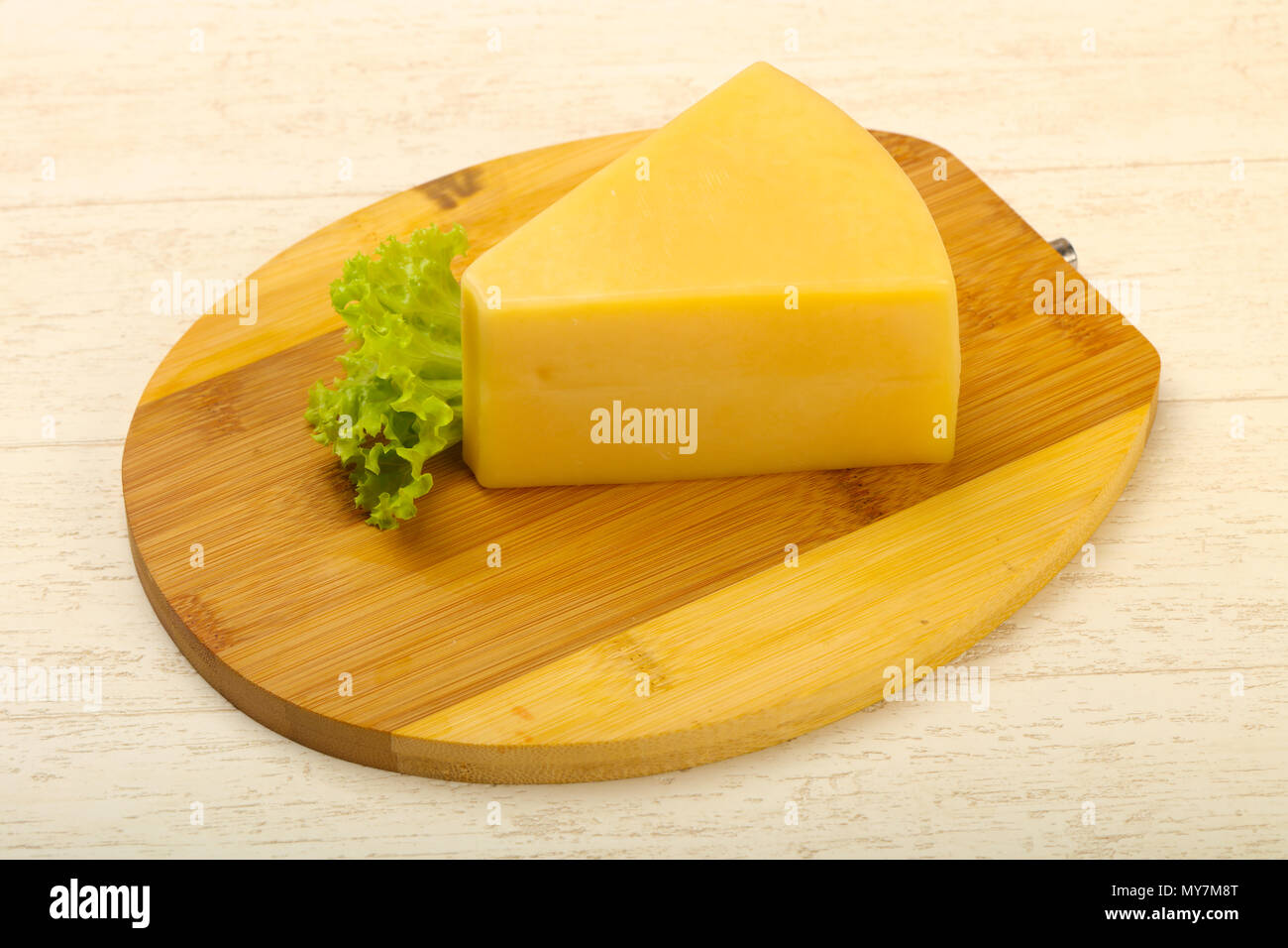 Parmesan cheese triangle Stock Photo - Alamy