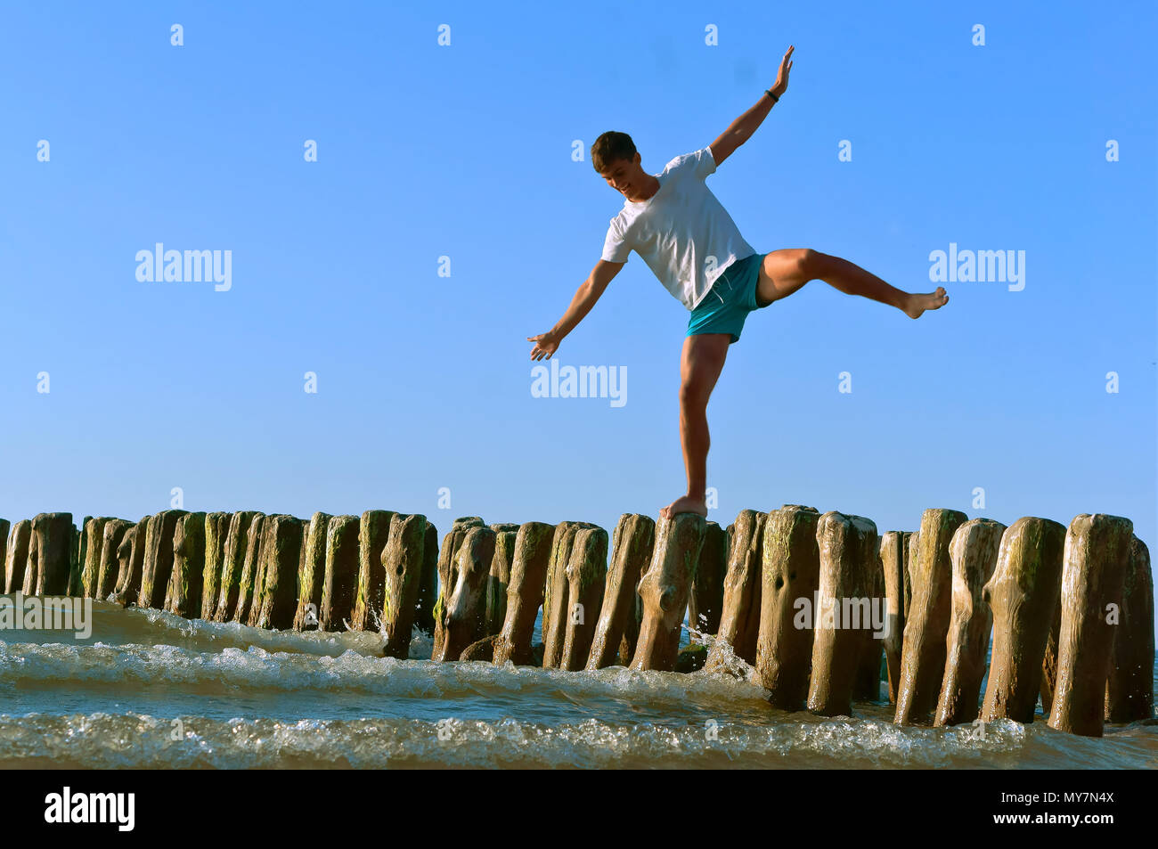 Man standing in ocean waves hi-res stock photography and images - Alamy