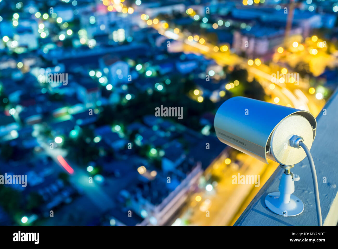 CCTV Camera or surveillance Operating in night time with city blur in ...