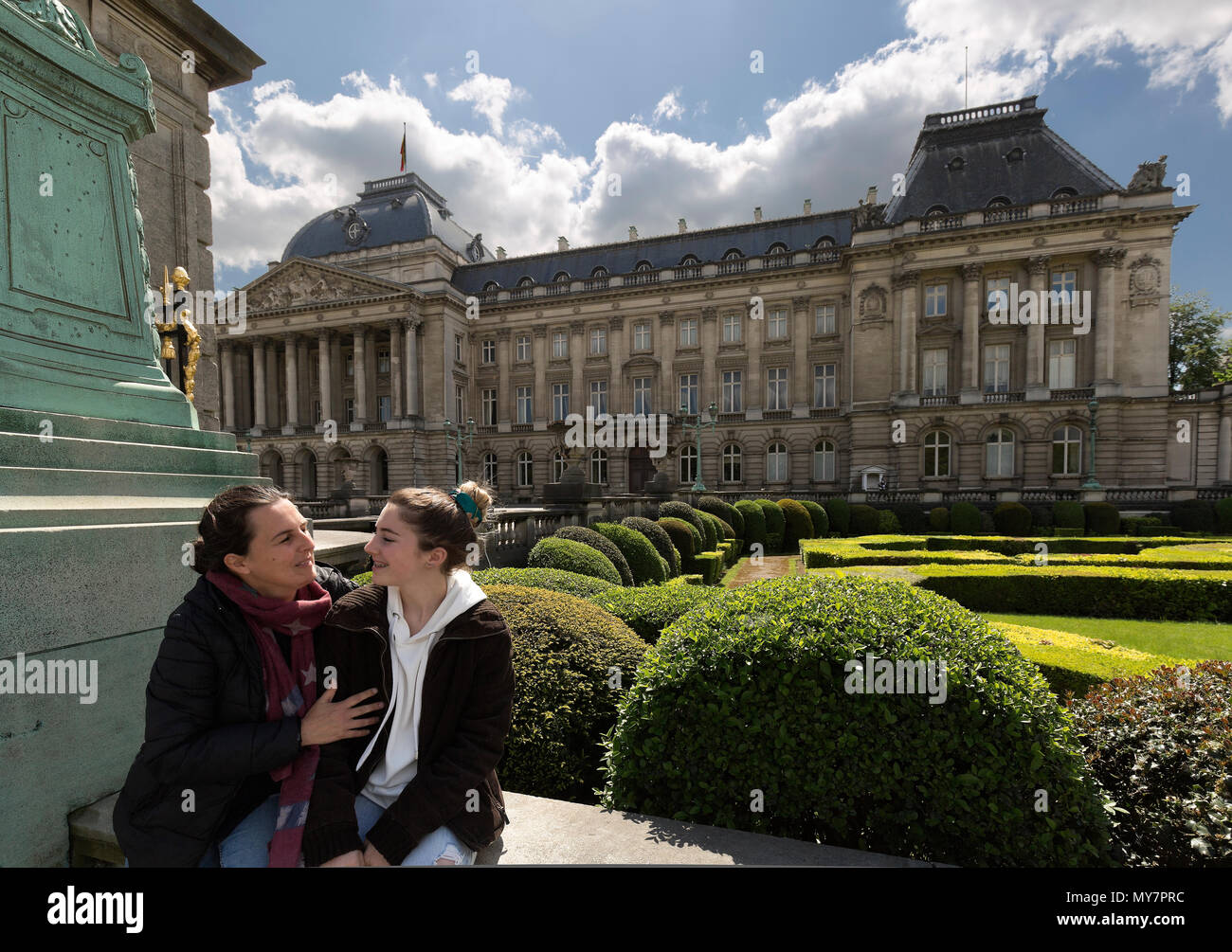 Mother and daughter next to the royal palace with its gardens in ...