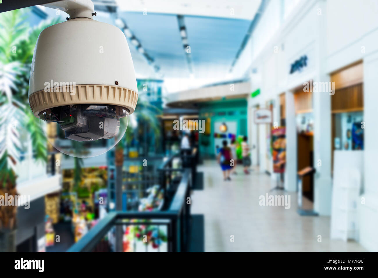 CCTV Camera of Surveillance operating in building with people in ...