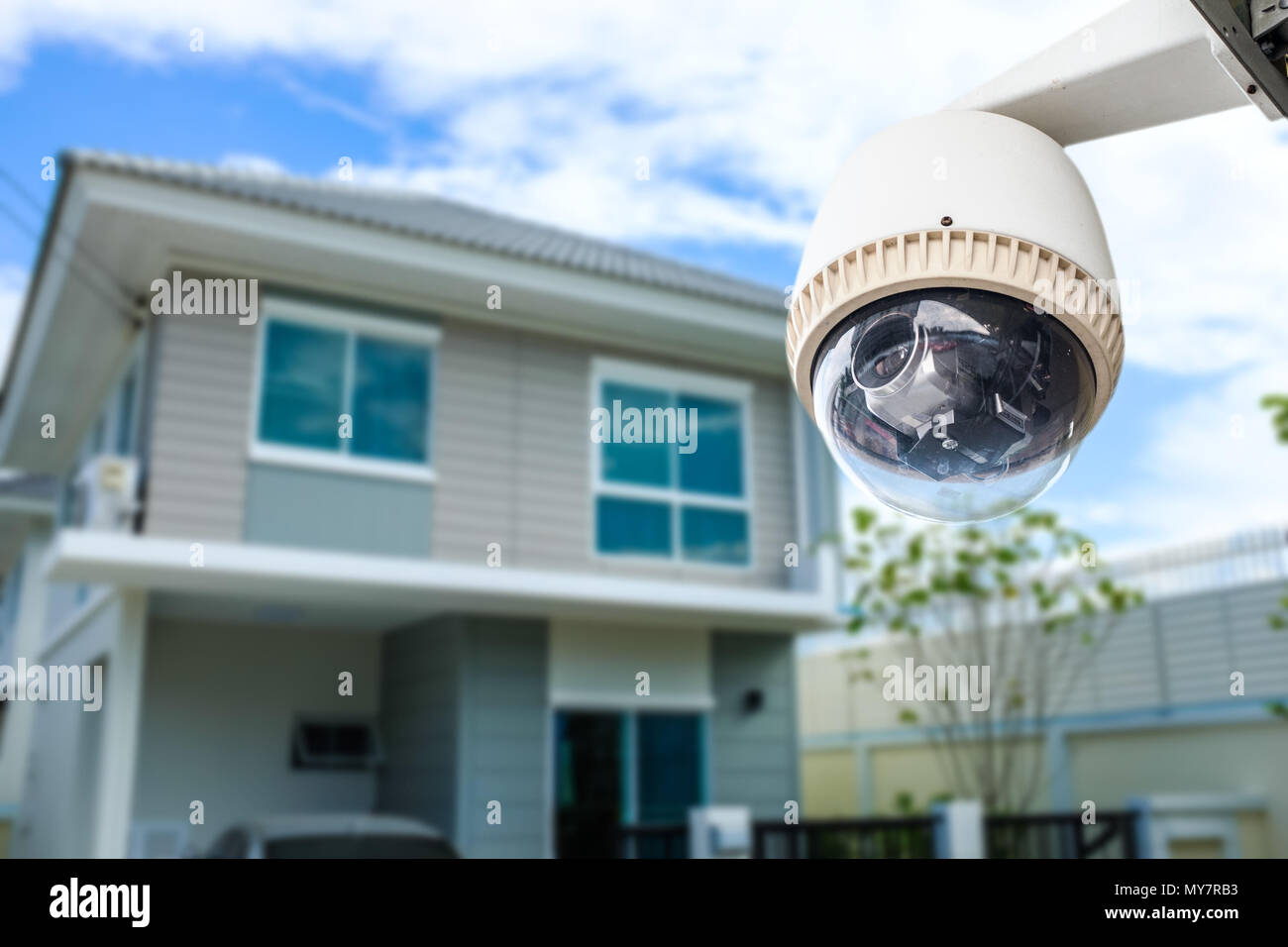 CCTV Camera or surveillance operating with house village in background ...