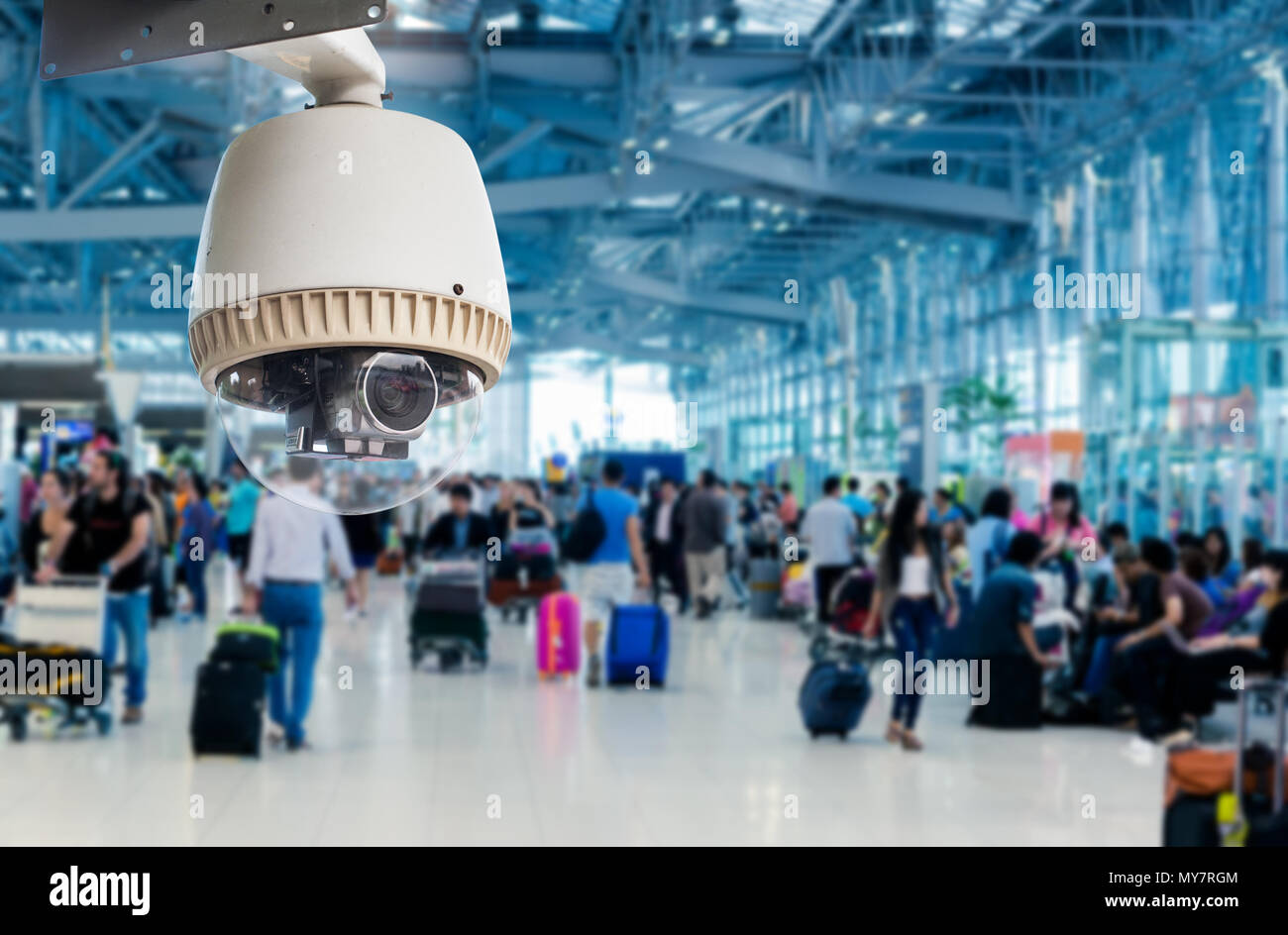CCTV camera or surveillance operating in air port Stock Photo - Alamy