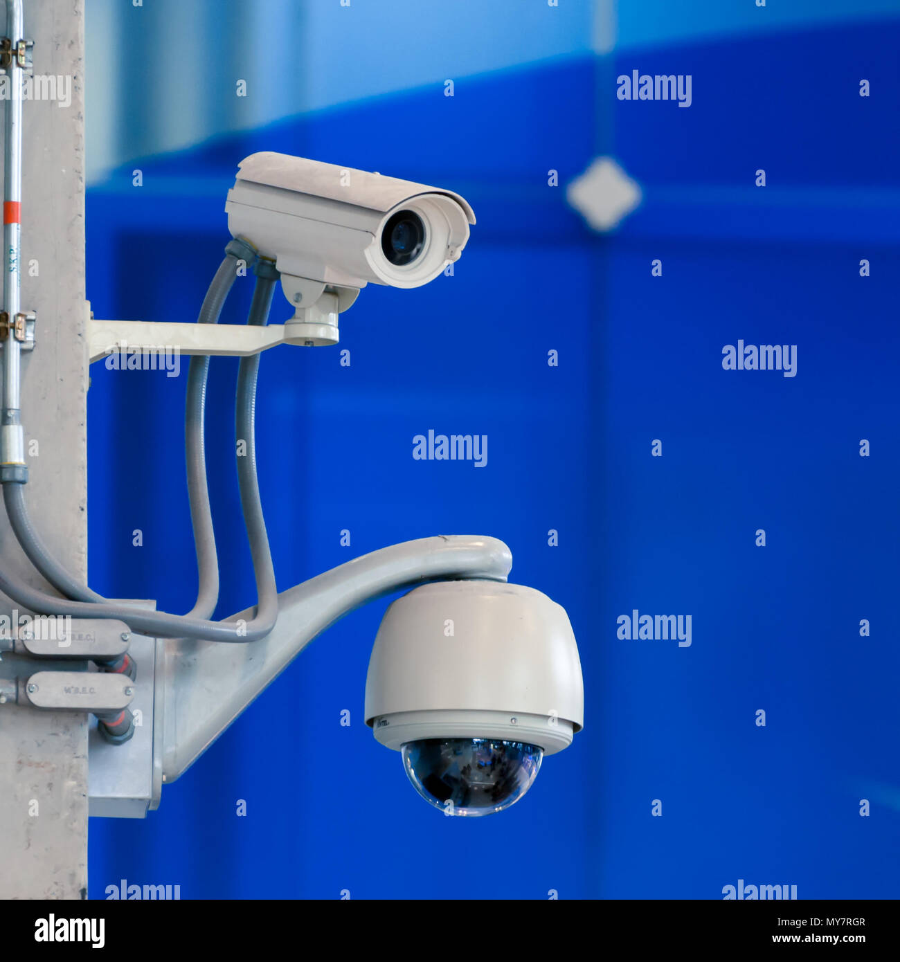 Cctv camera on blue wall hi-res stock photography and images - Alamy