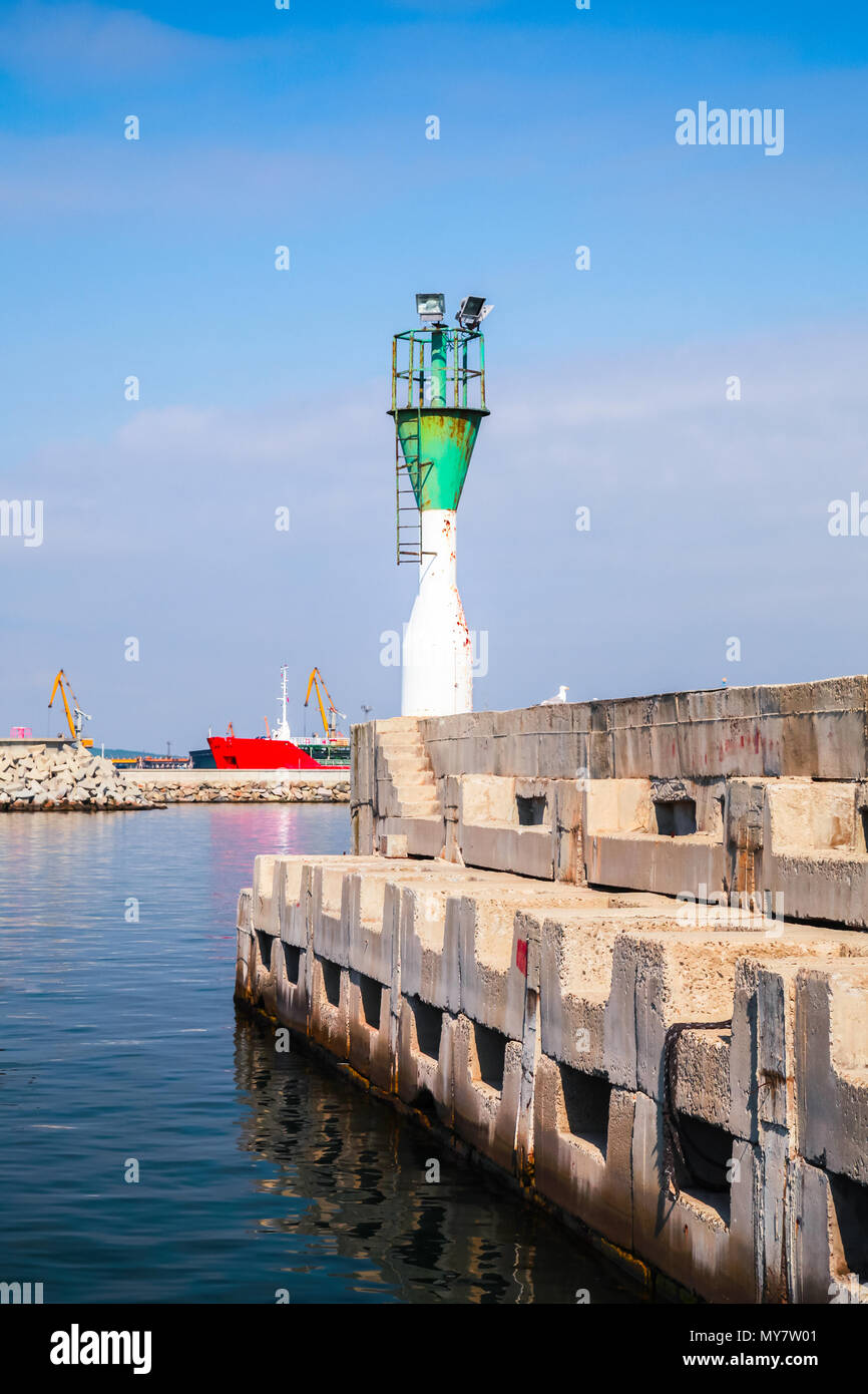 Green and white lighthouse tower in Burgas port, Black Sea coast ...