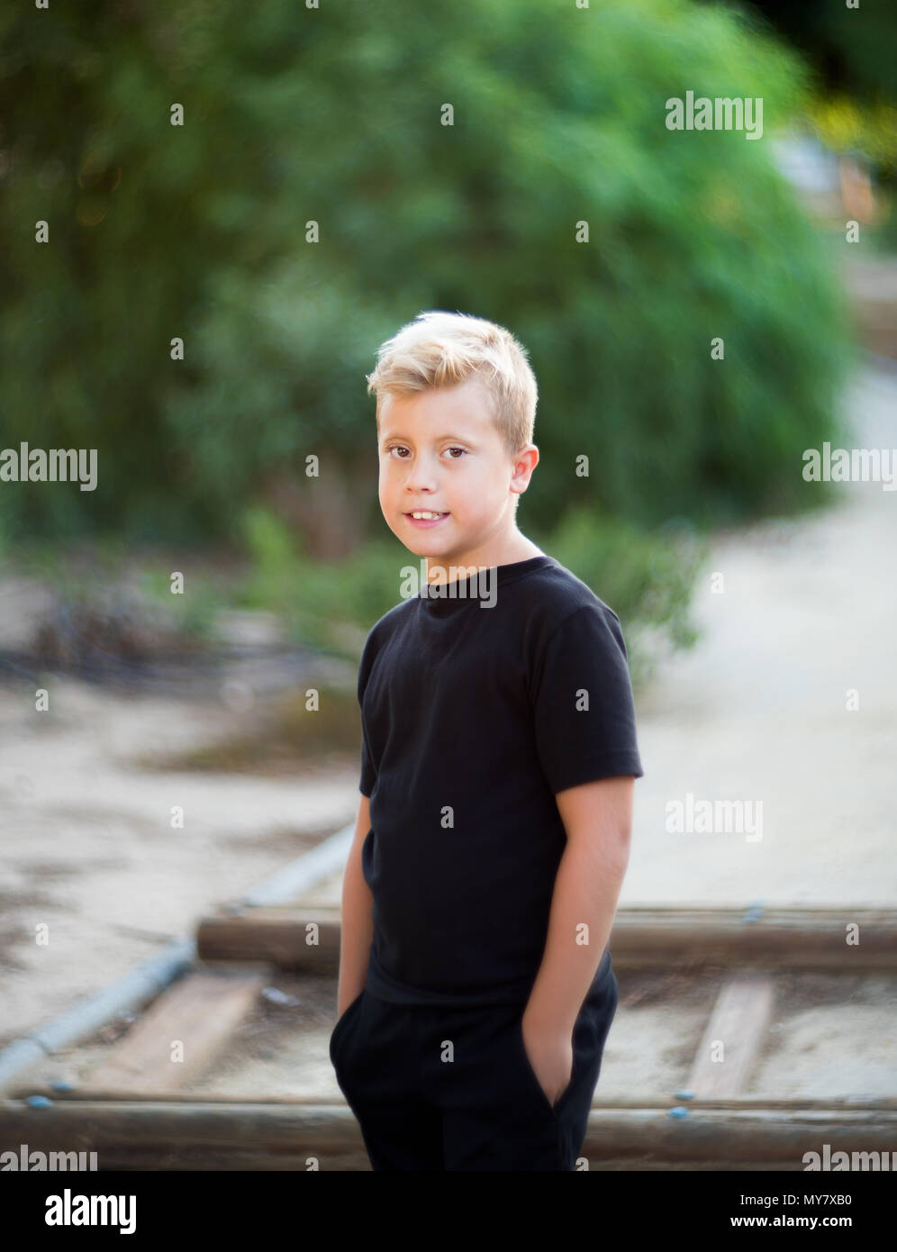 Handsome cute boy on nature background Stock Photo - Alamy