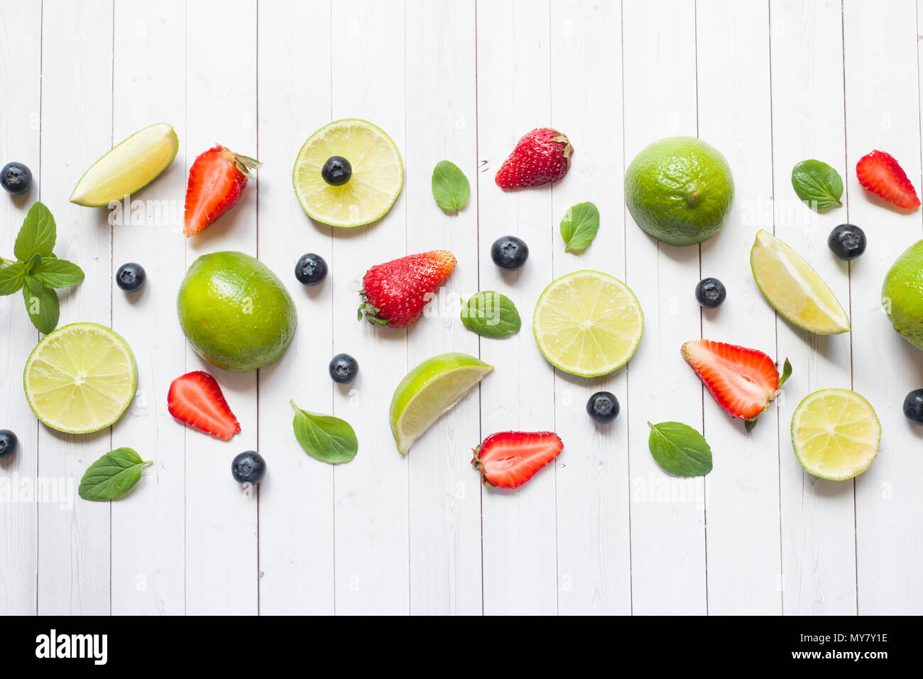 Fresh berries of citrus lime mint blueberries strawberry on a light ...
