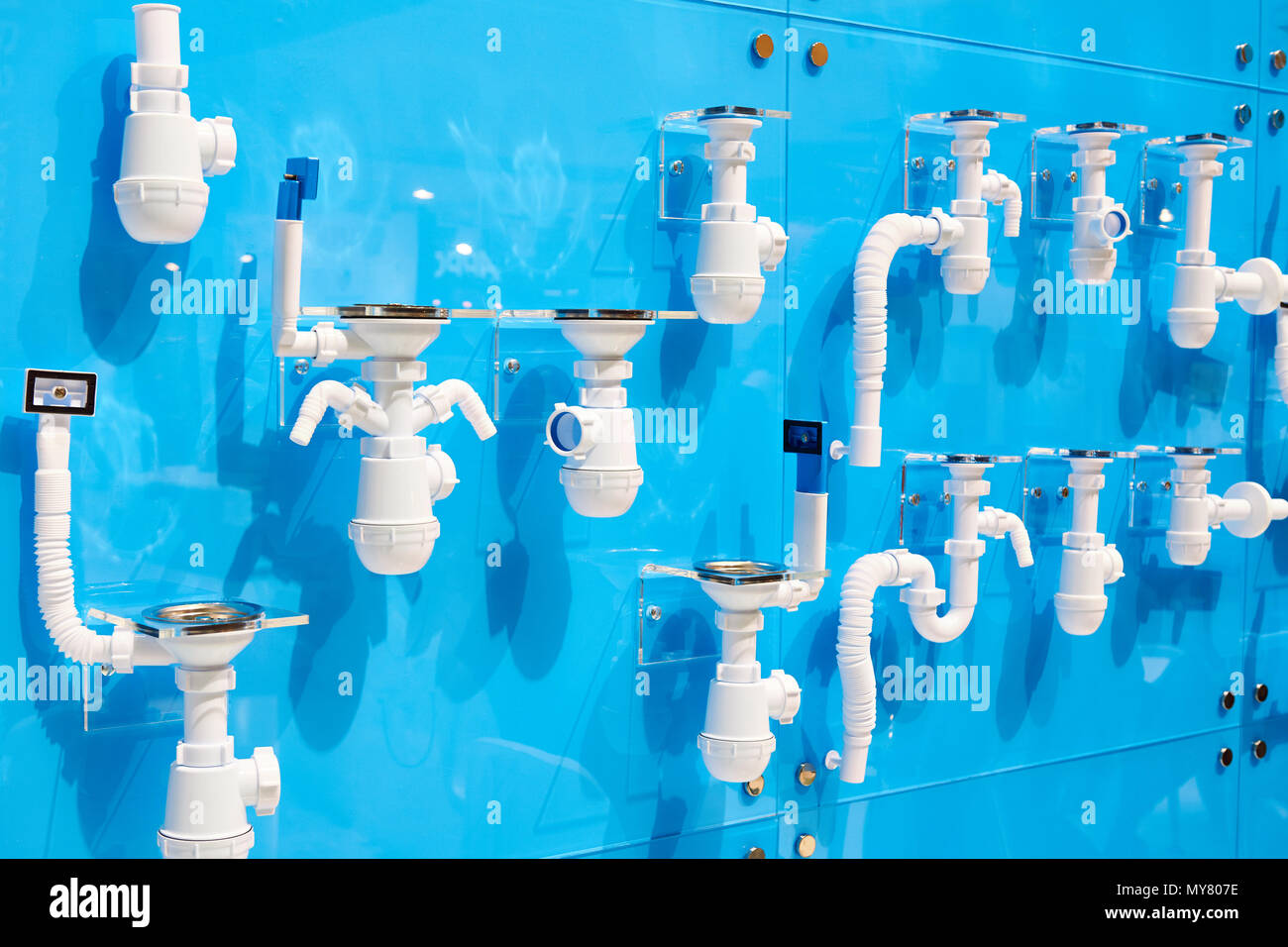 Corrugated plastic drain pipes for sinks in store Stock Photo - Alamy