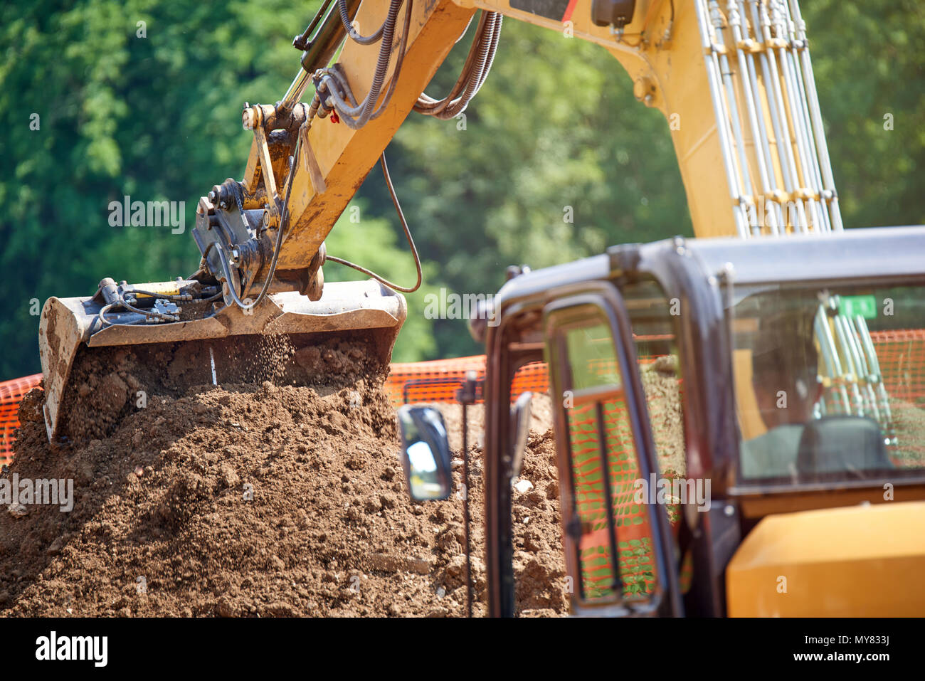 Backhoe - Bulldozer in open field operation Excavator at Construction ...