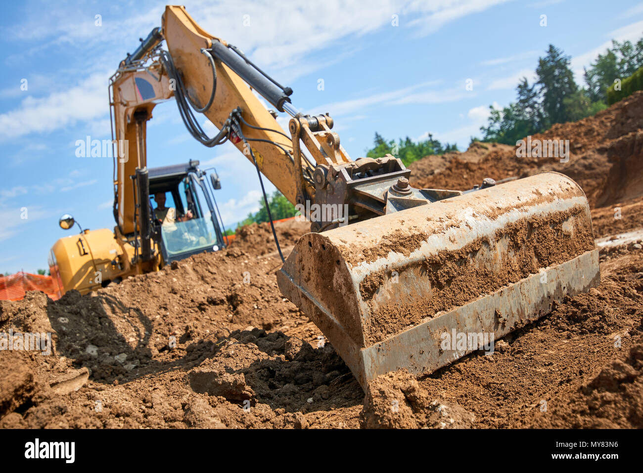 Backhoe - Bulldozer in open field operation Excavator at Construction ...