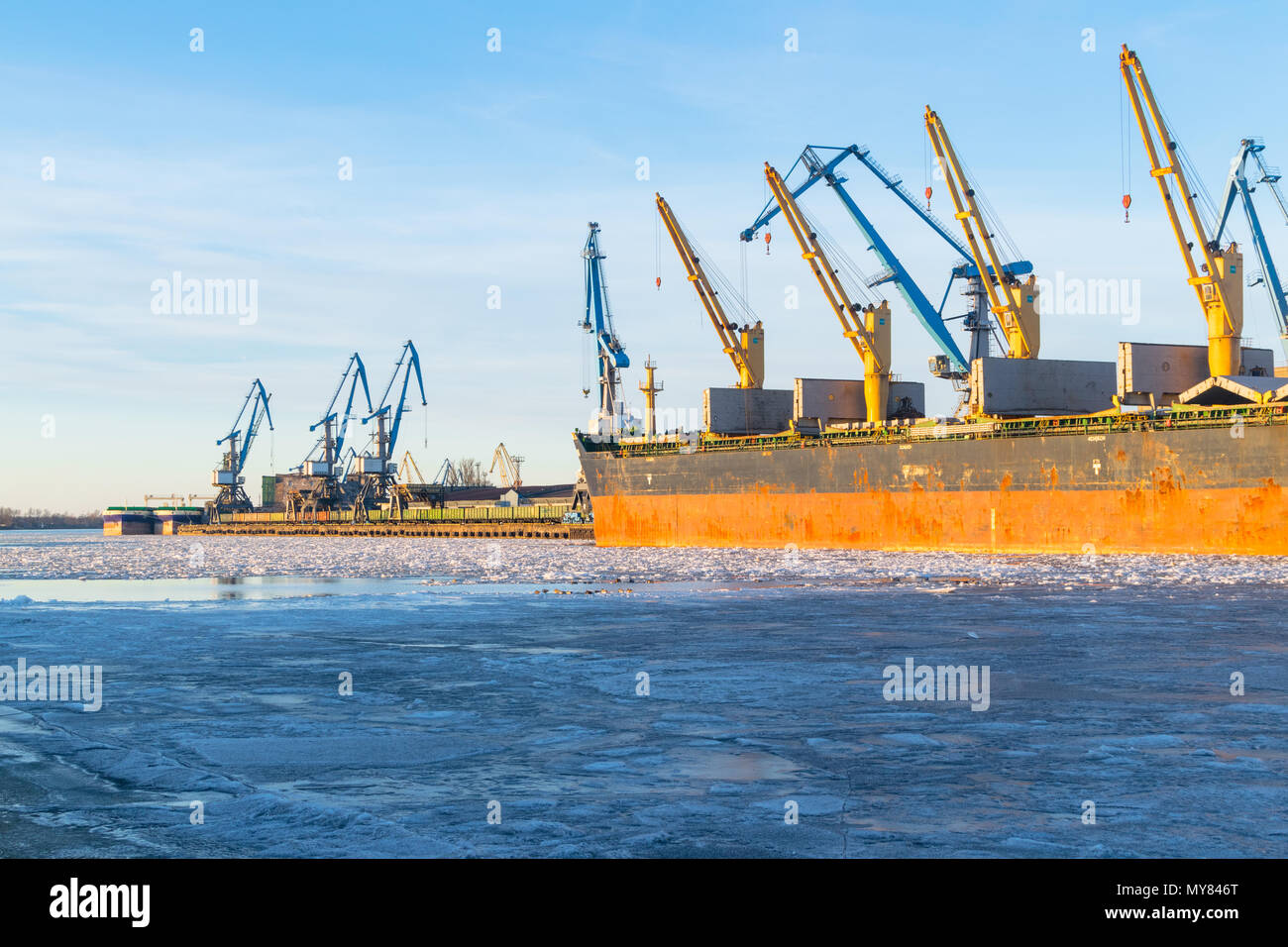 Industrial cargo cranes in the dock. Container cargo freight ship with ...