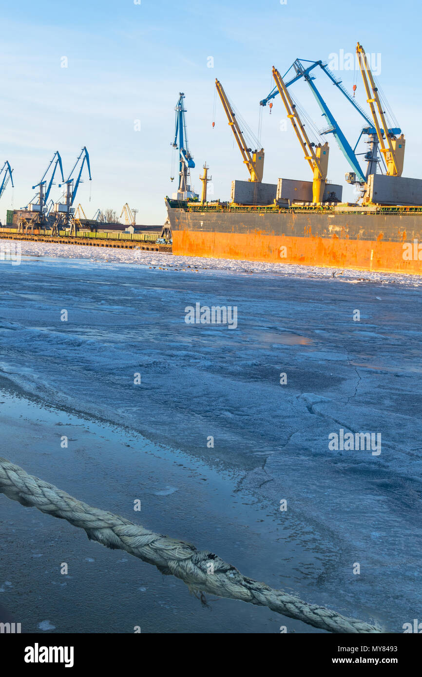 Industrial cargo cranes in the dock. Container cargo freight ship with ...