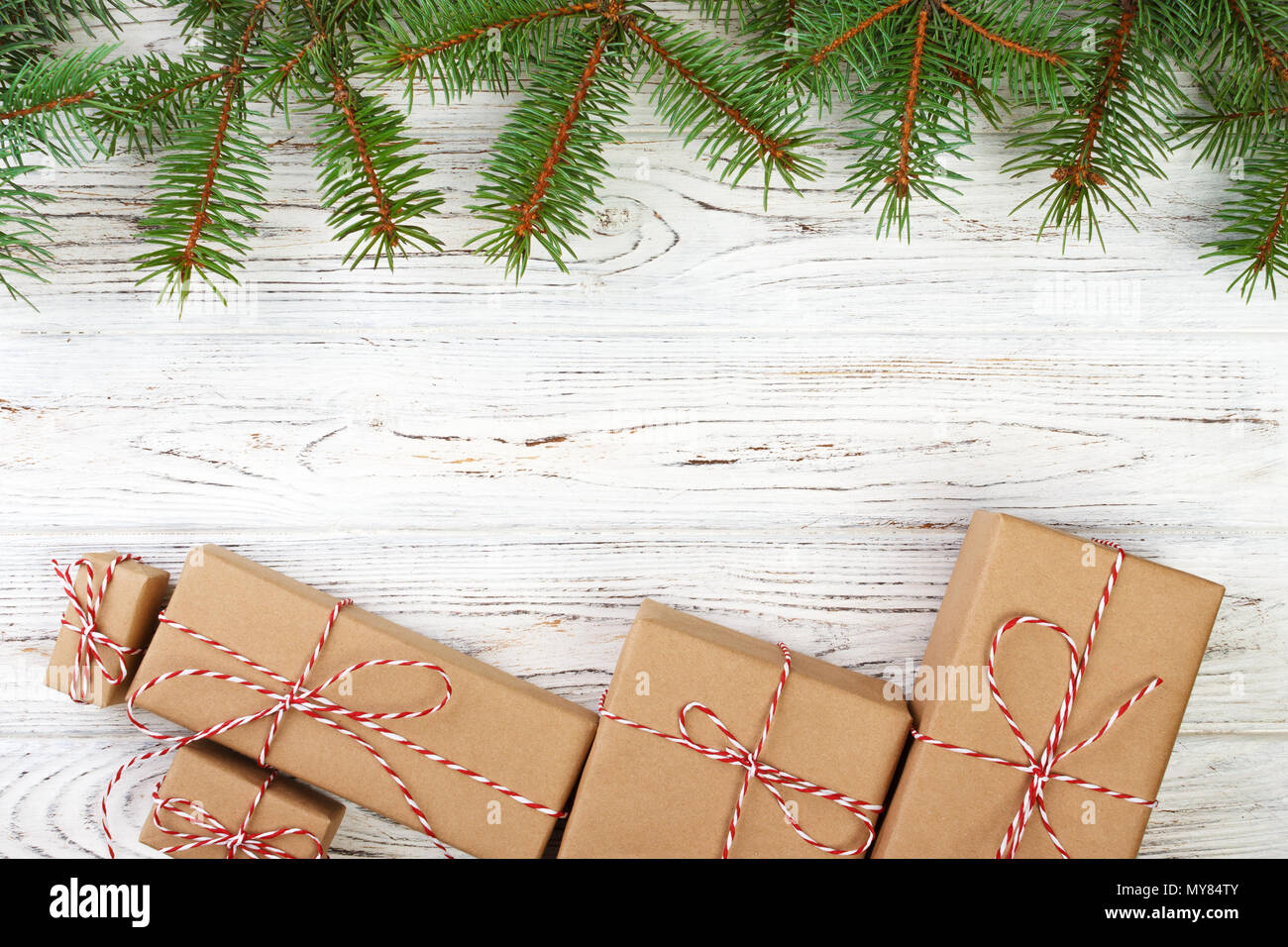 Pretty Christmas holiday border with decorative gifts tied with red ...