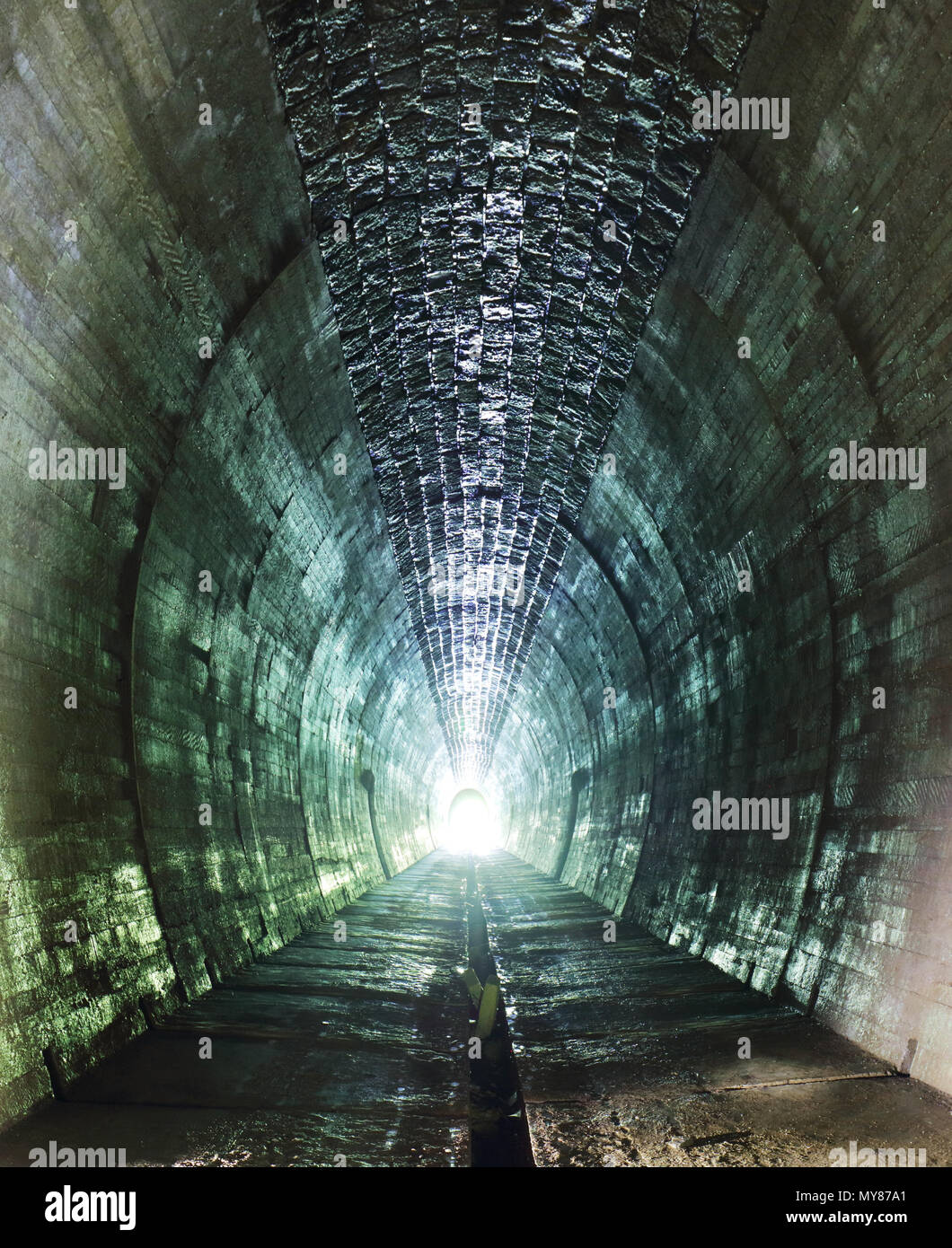 Inside of a grungy tunnel Stock Photo - Alamy