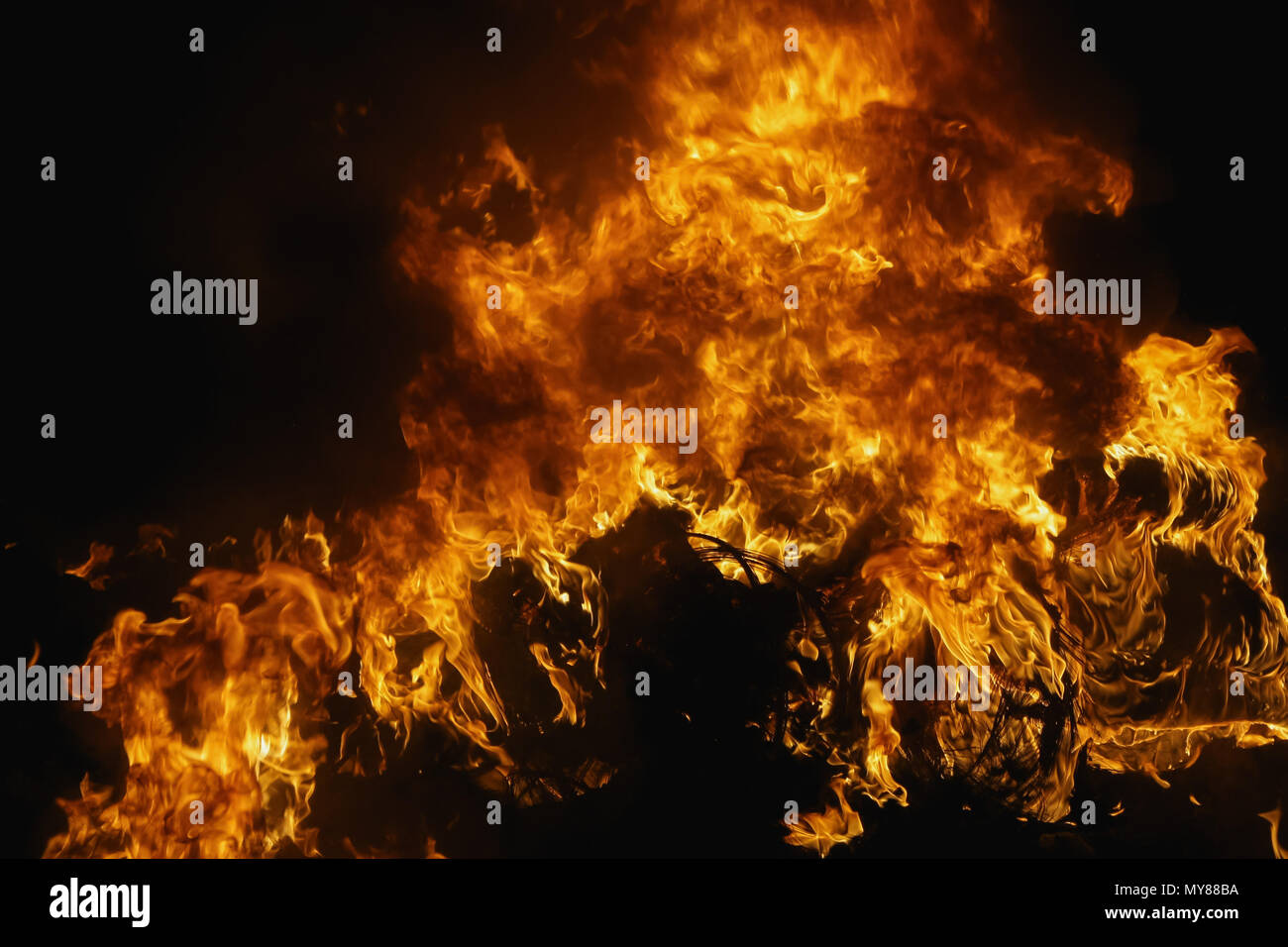 a huge bonfire flame texture background Stock Photo - Alamy