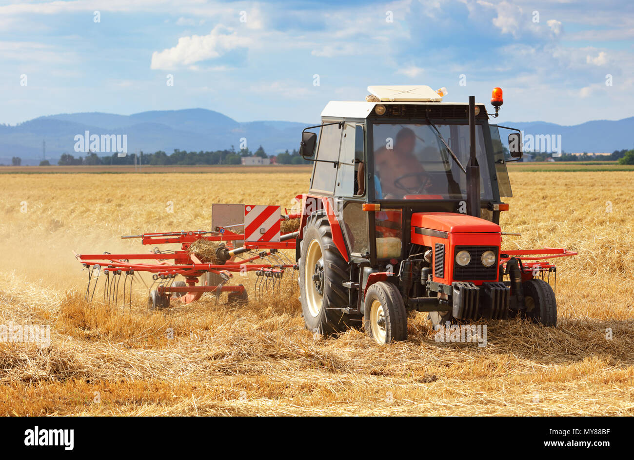 Tractor in field Stock Photo - Alamy