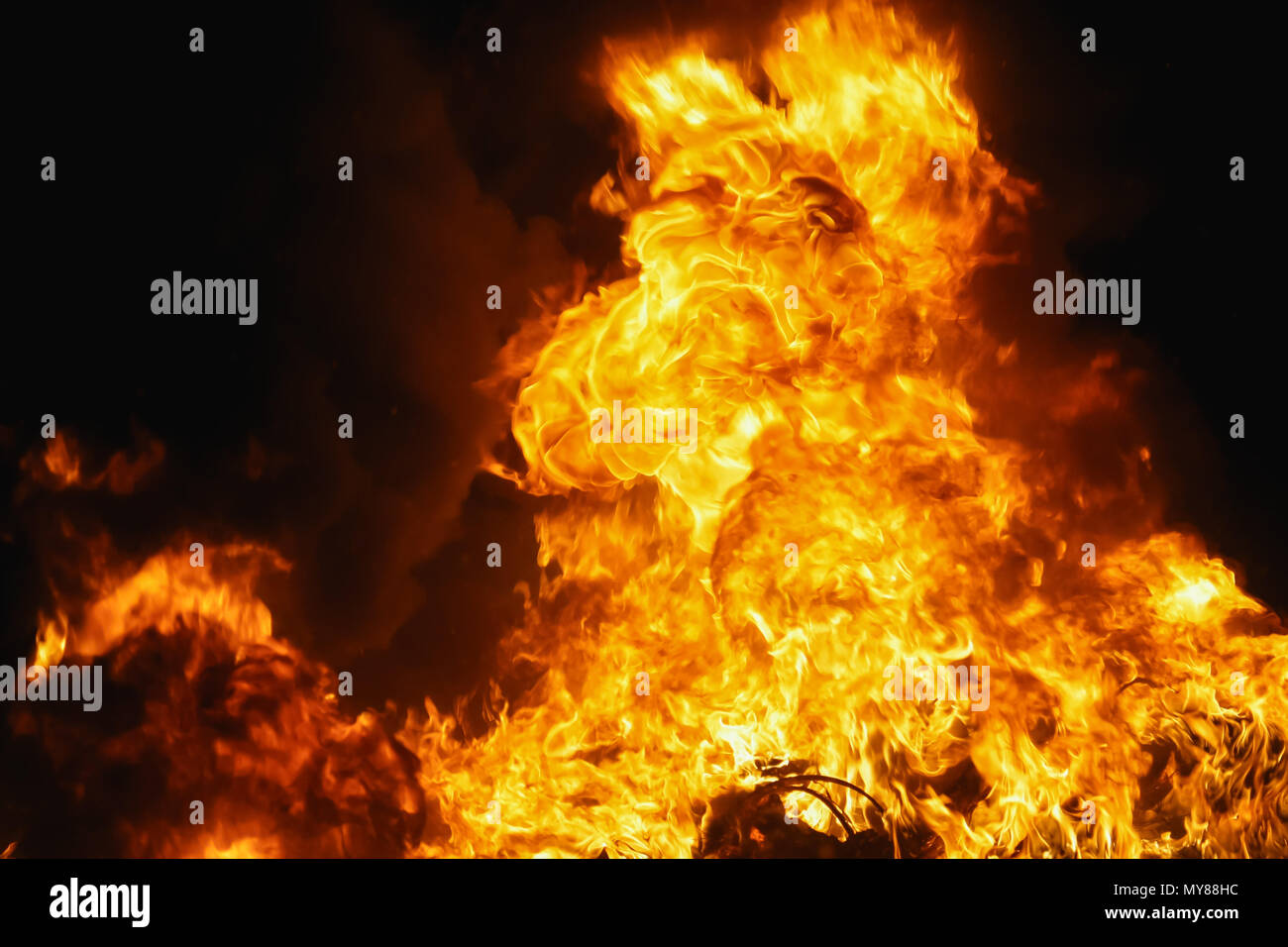 a huge bonfire flame texture background Stock Photo - Alamy