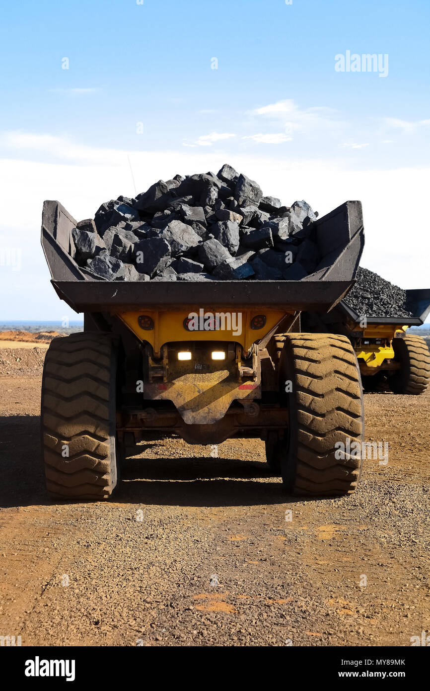 Manganese Mining and processing, large ore rocks being transported on ...