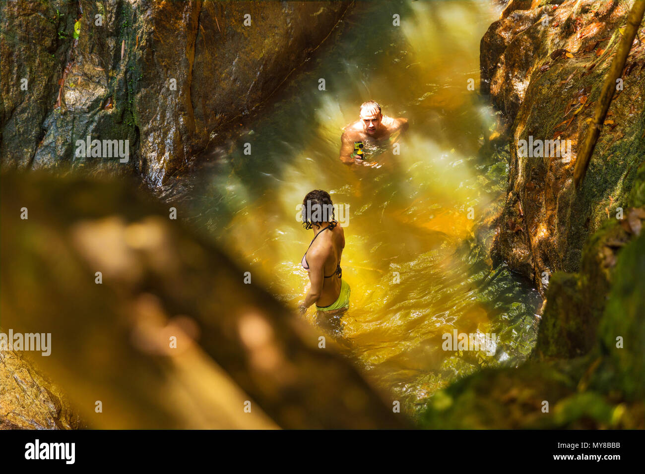 Woman bathing in waterfall hi-res stock photography and images - Alamy