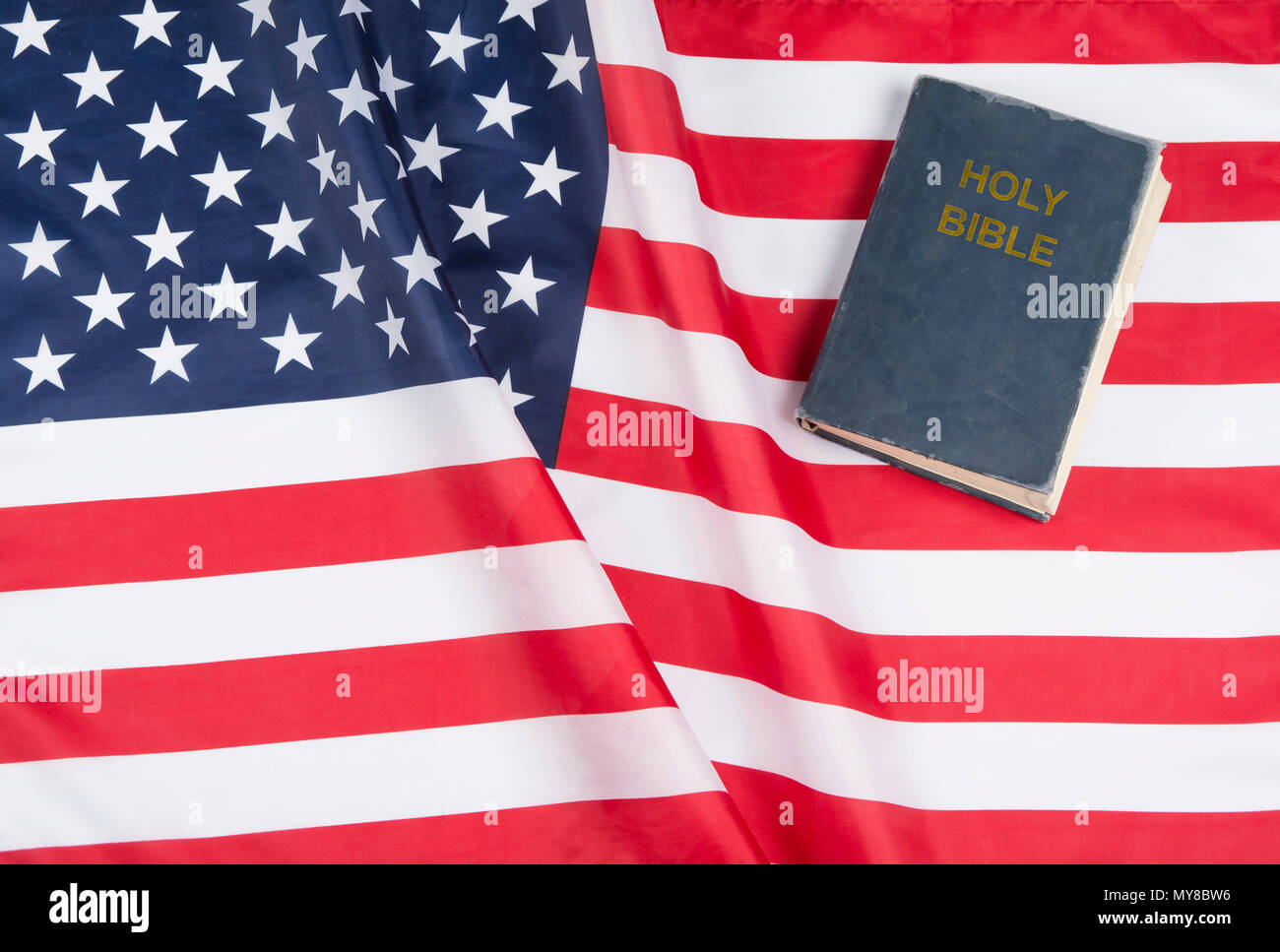 American flag with US constitution or holy bible Stock Photo - Alamy