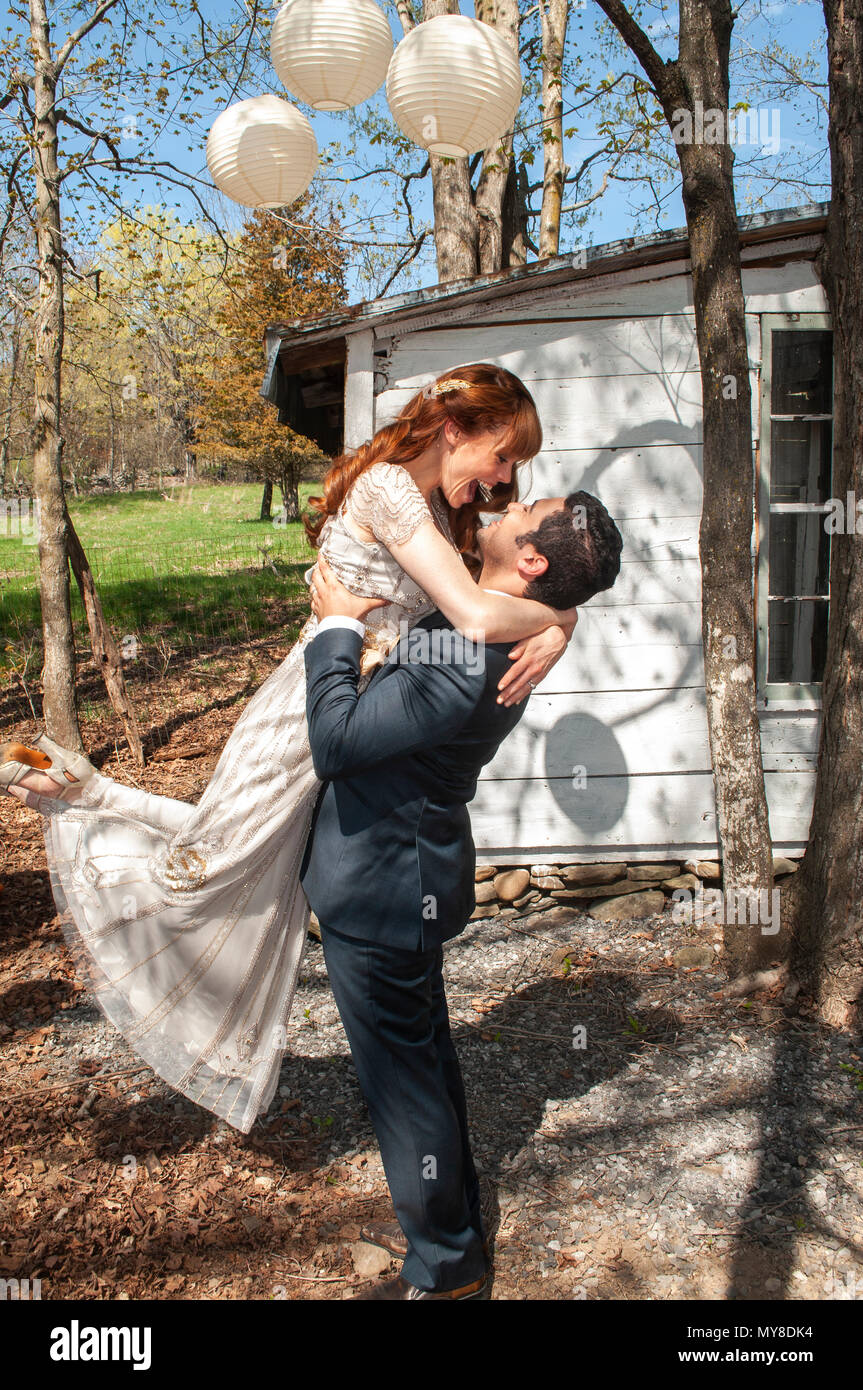 Man lifting woman up legs hi-res stock photography and images - Alamy