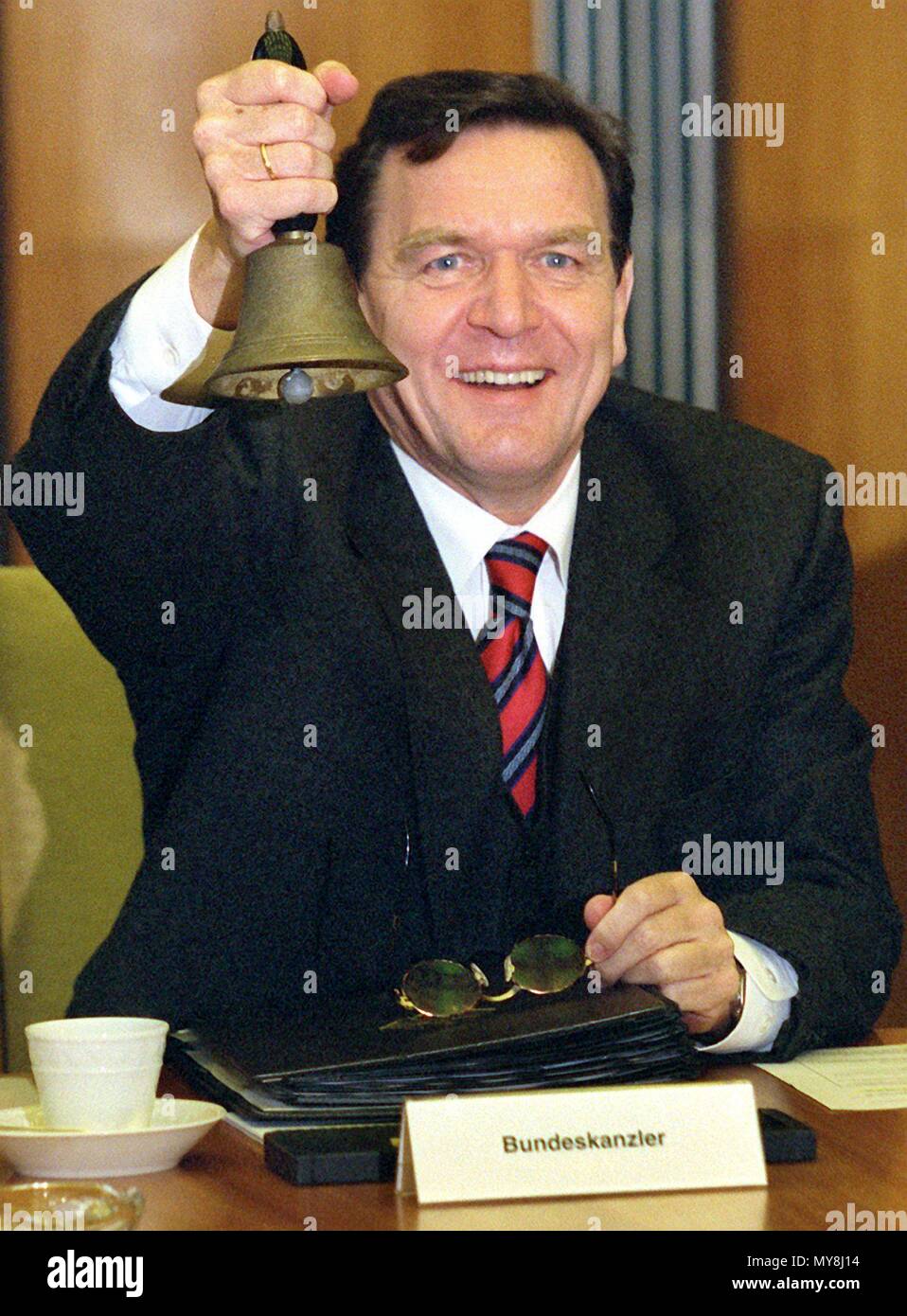 German Chancellor Gerhard Schroeder rings the bell at the first cabinet ...
