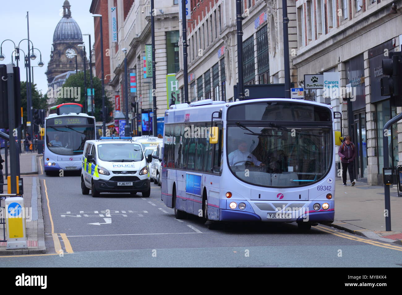 Buses heading down the Headrow in Leeds City Centre Stock Photo - Alamy