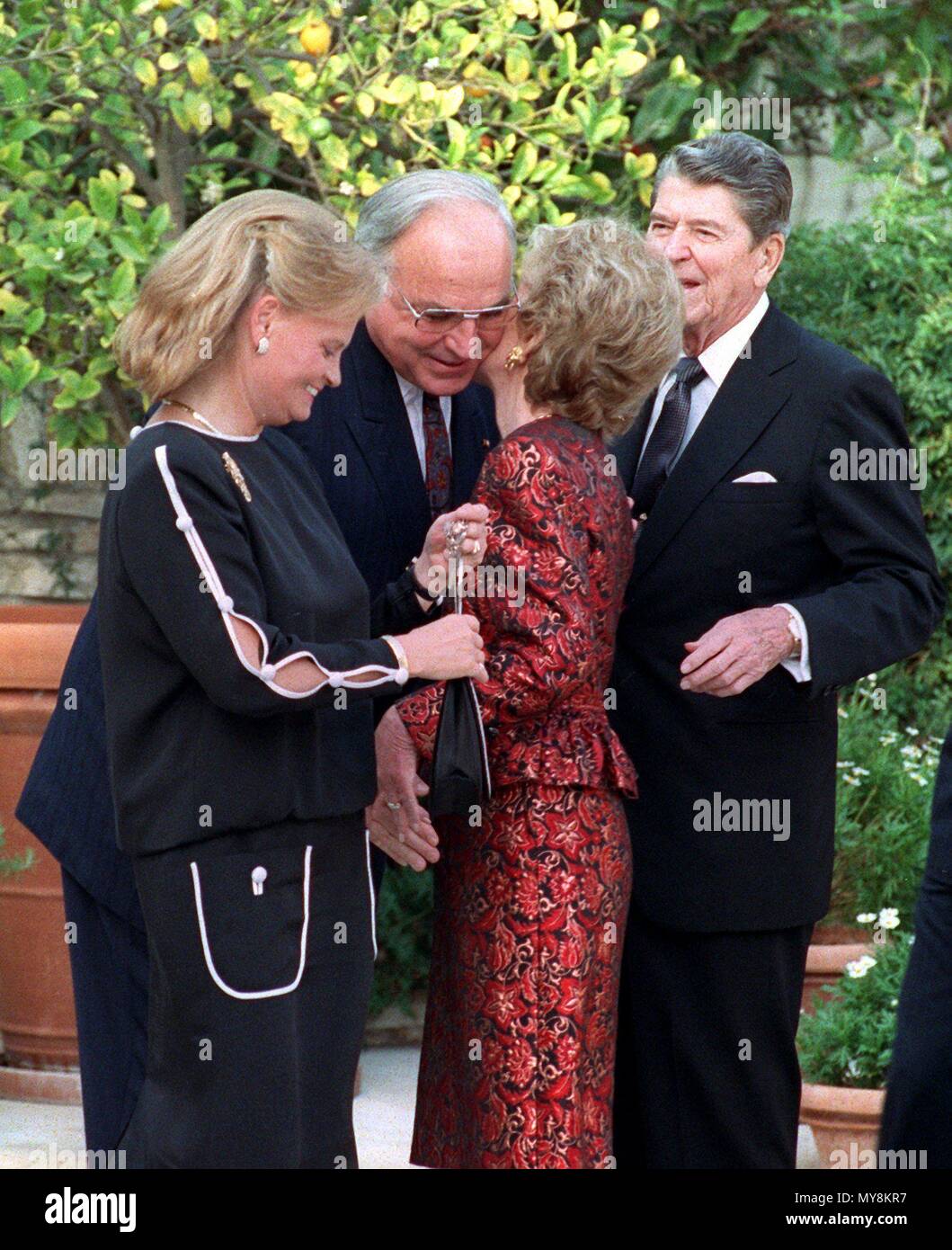 Hannelore and Helmut Kohl (L) are greeted by Nancy and Ronald Reagan in ...