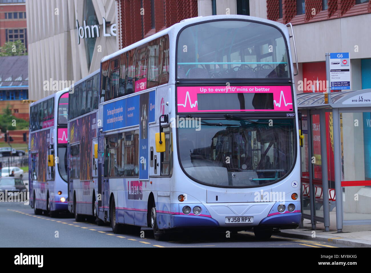 Buses on Eastgate in Leeds City Centre Stock Photo - Alamy