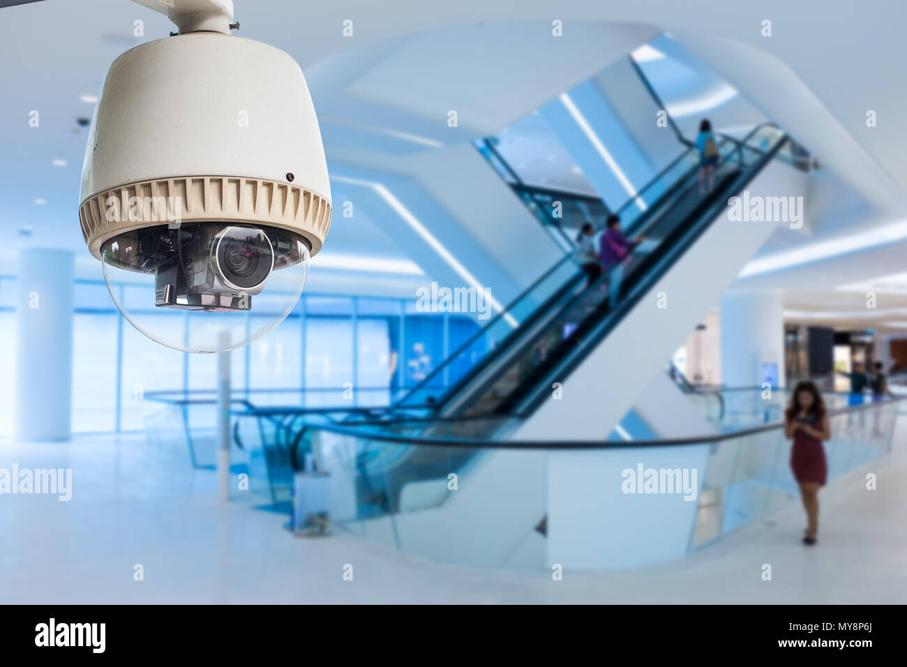 CCTV camera or surveillance operating in glass building Stock Photo - Alamy