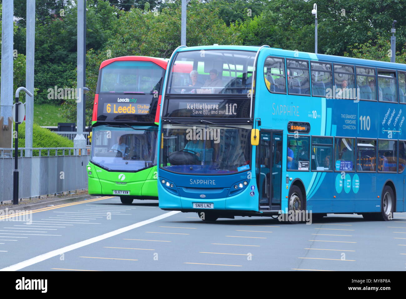 First Bus & Arriva Double Decker Buses leaving Leeds Bus Station Stock ...