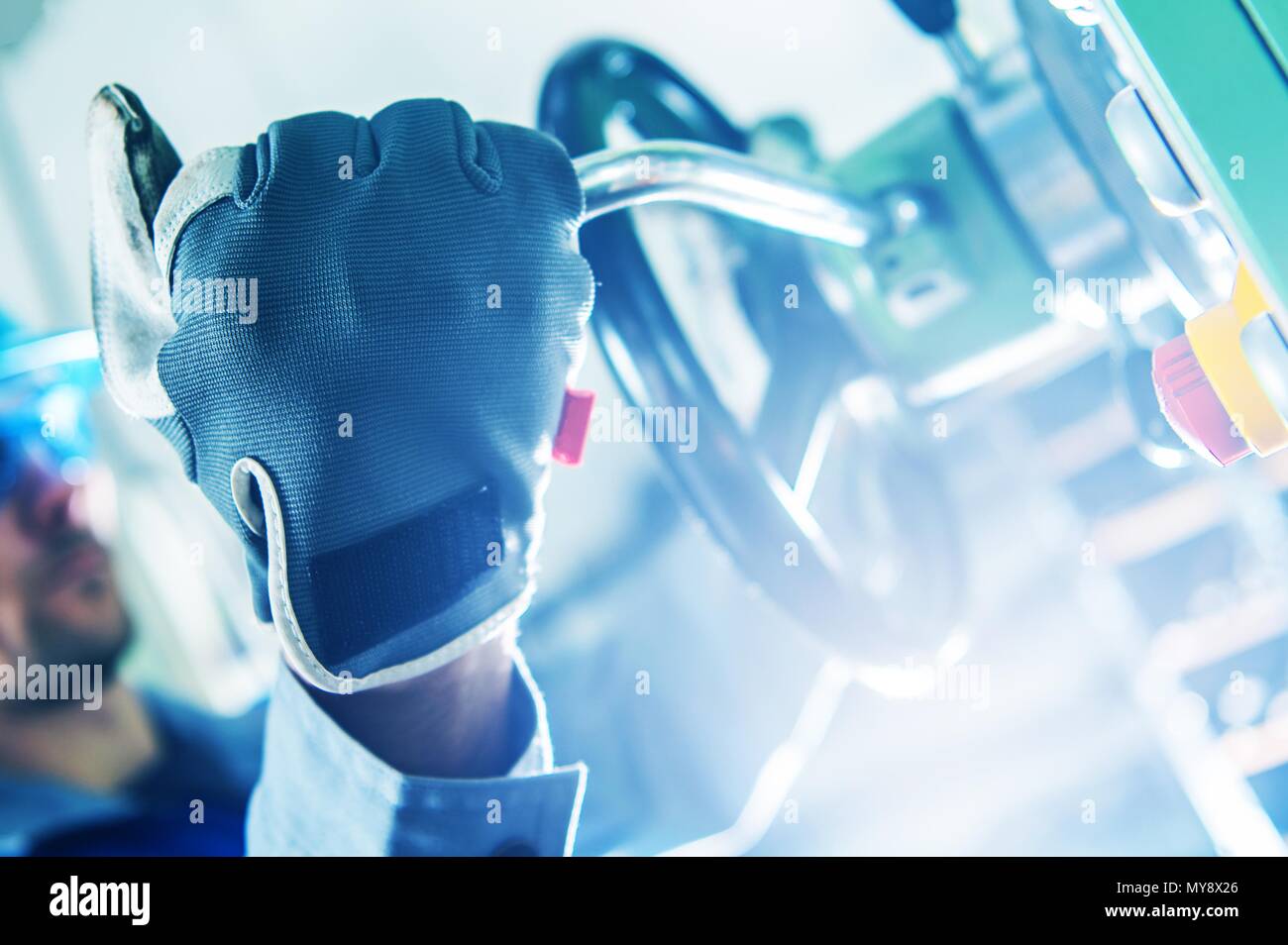 Machine Operator Closeup. Men Adjusting Lathe Machine Stock Photo - Alamy