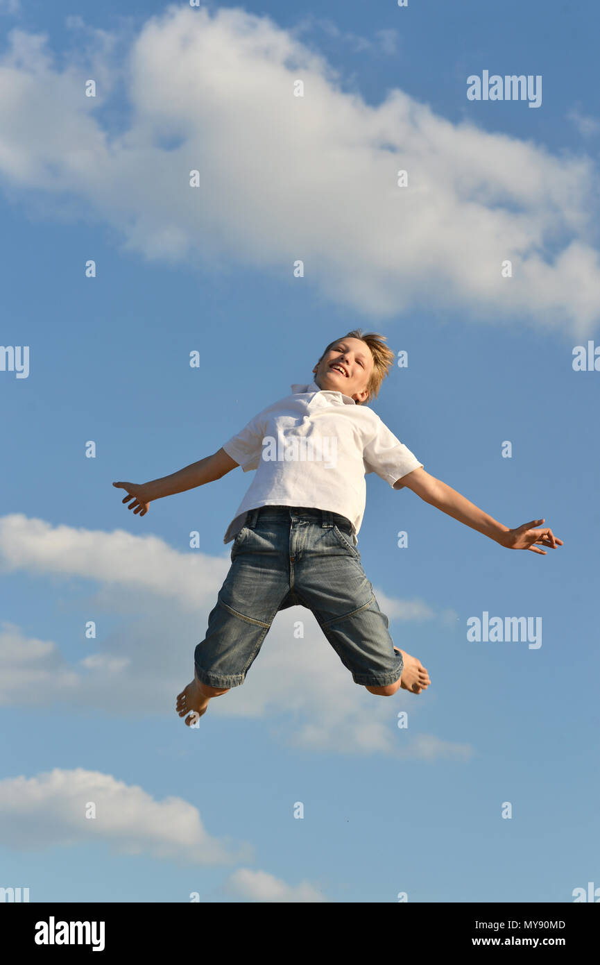 Teen boy jumping Stock Photo - Alamy