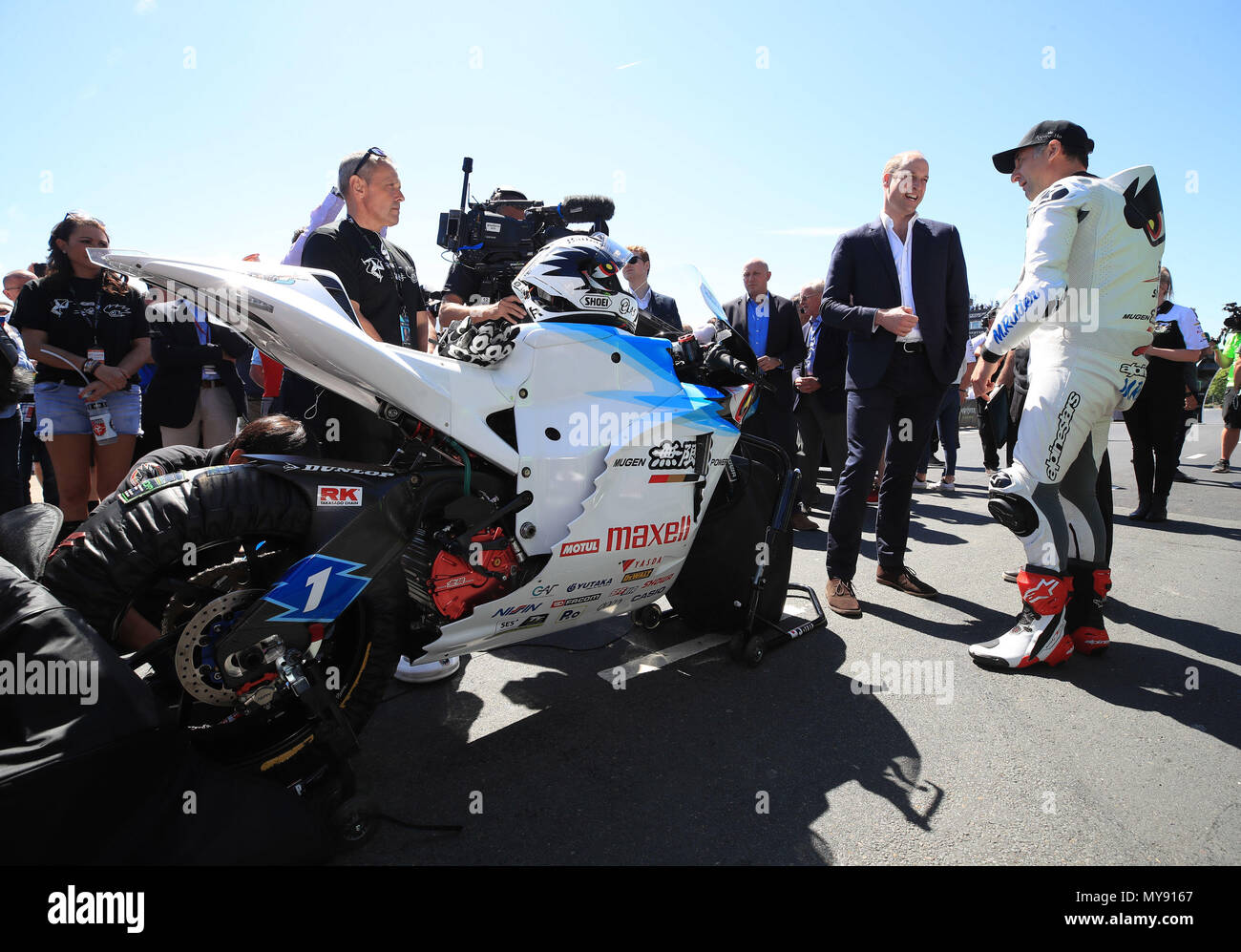 The Duke of Cambridge is shown a bike by motorcyclist Michael Rutter as ...