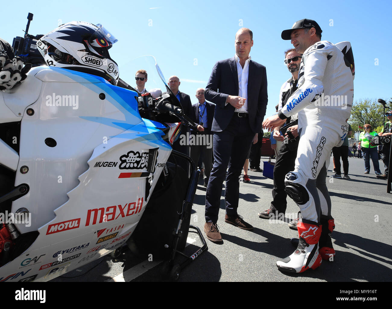 The Duke of Cambridge is shown a bike by motorcyclist Michael Rutter as ...