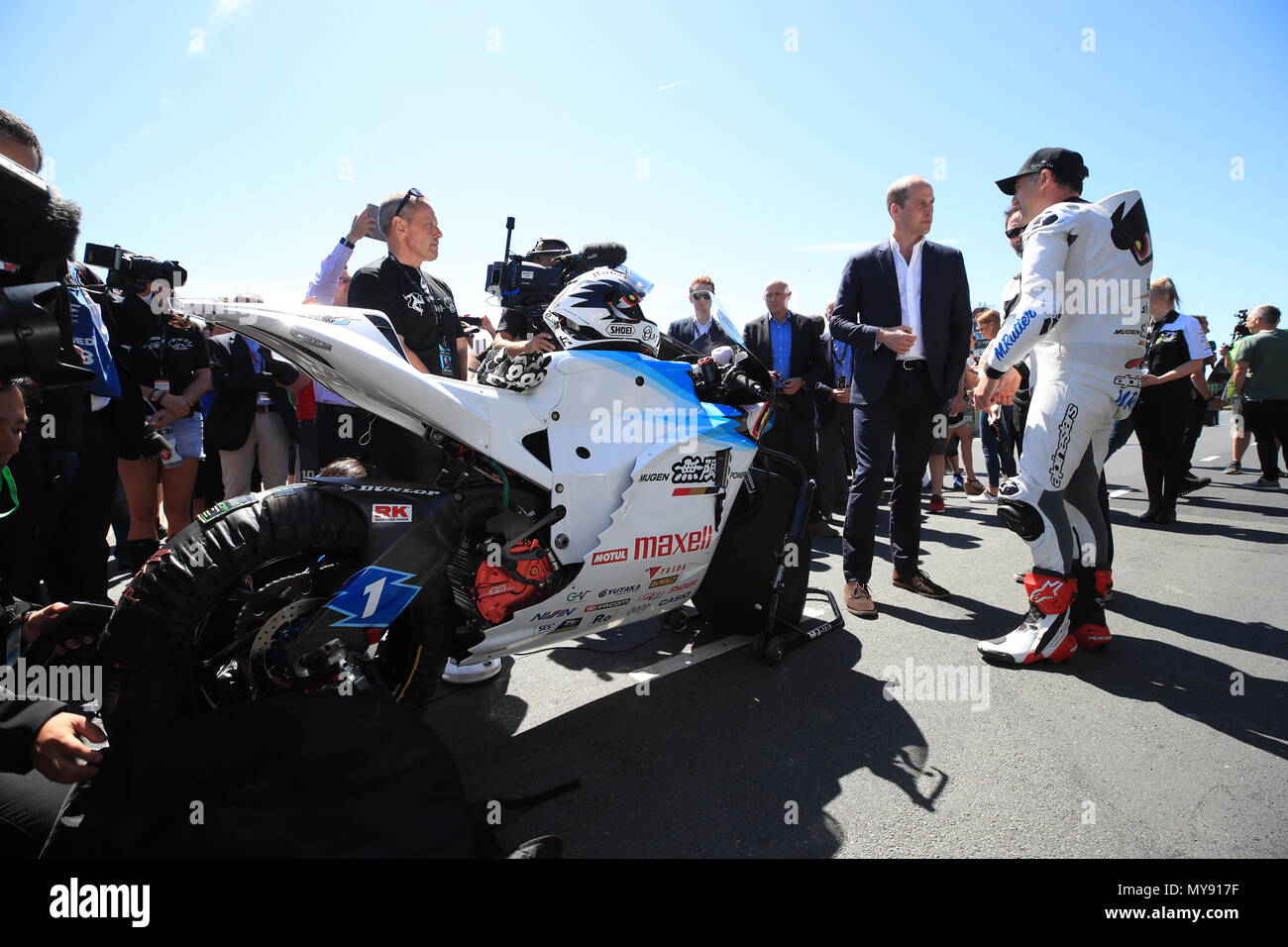 The Duke of Cambridge is shown a bike by motorcyclist Michael Rutter as ...