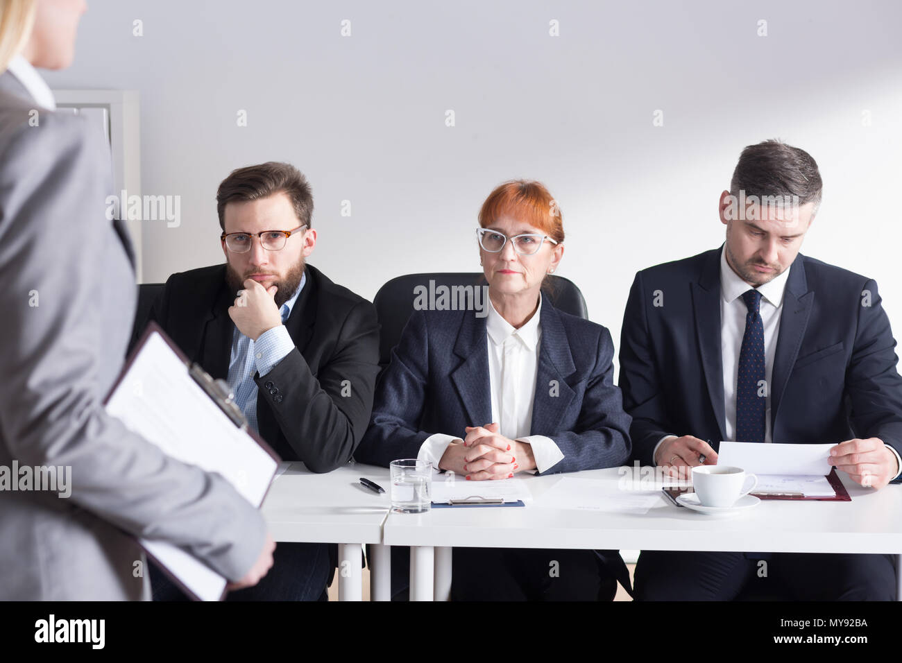 Three members of management during interview with applicant Stock Photo ...