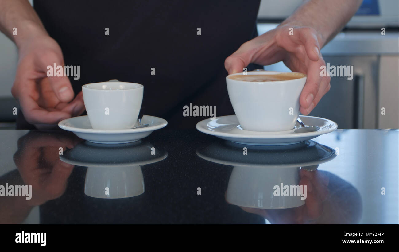 Two coffee cup prepared on the desk Stock Photo - Alamy