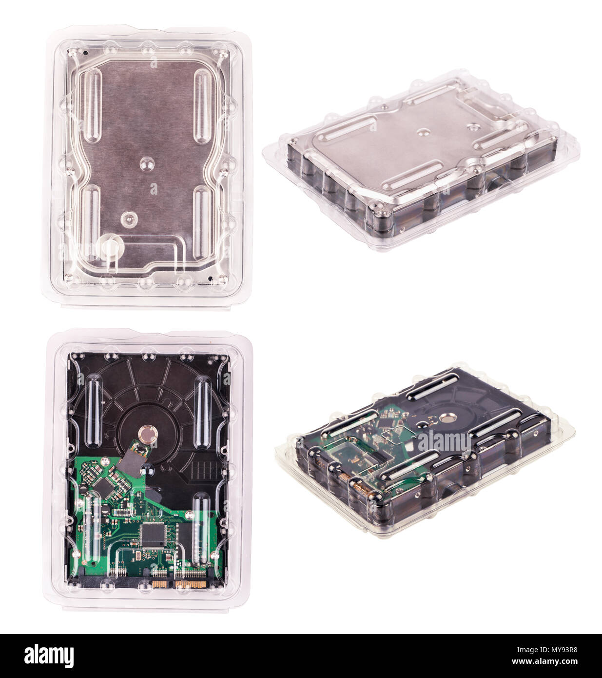 Collection of four hard disk drives in a transparent box isolated on ...