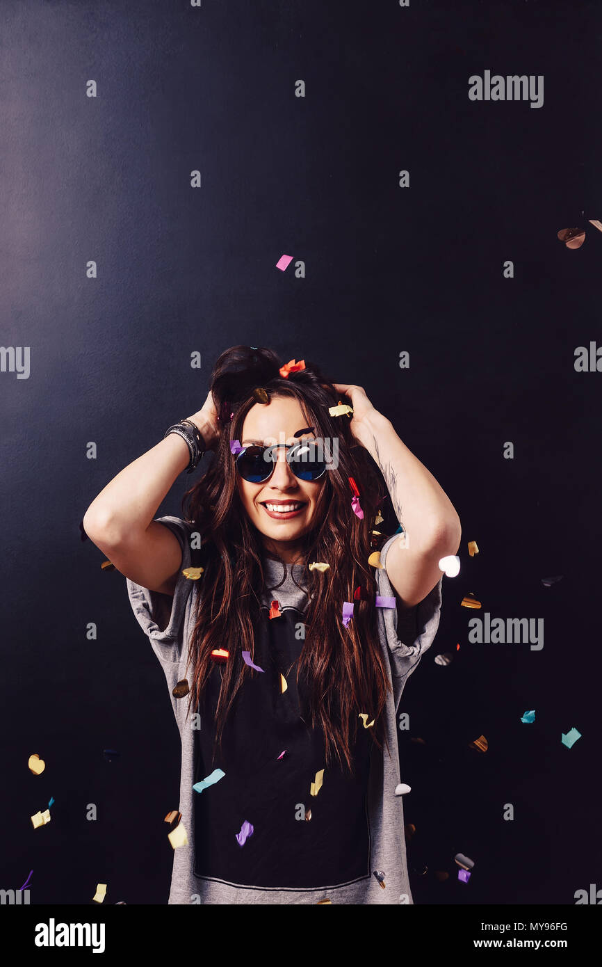 Adorable girl having fun with confetti Stock Photo - Alamy