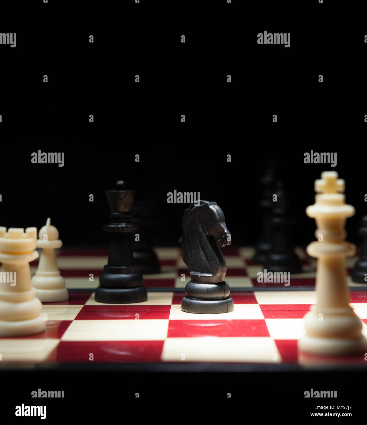 Chess character on black background for strategy business concept Stock ...