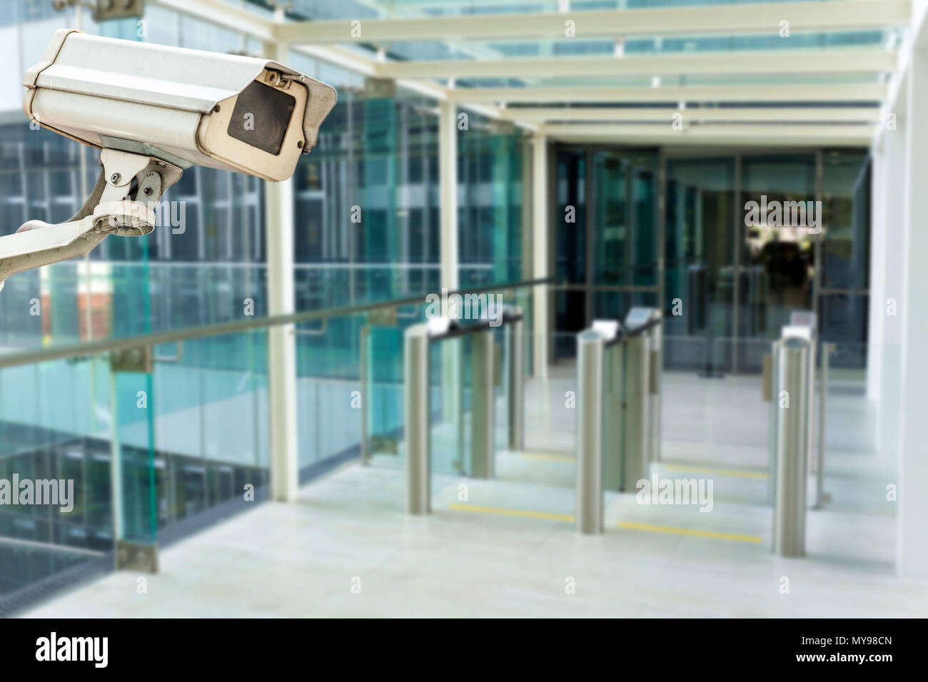 CCTV camera or surveillance operating in building entrance Stock Photo ...