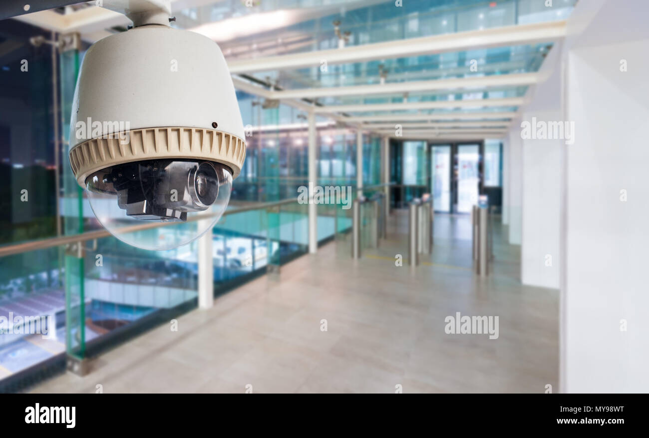 CCTV camera or surveillance operating in building entrance Stock Photo ...