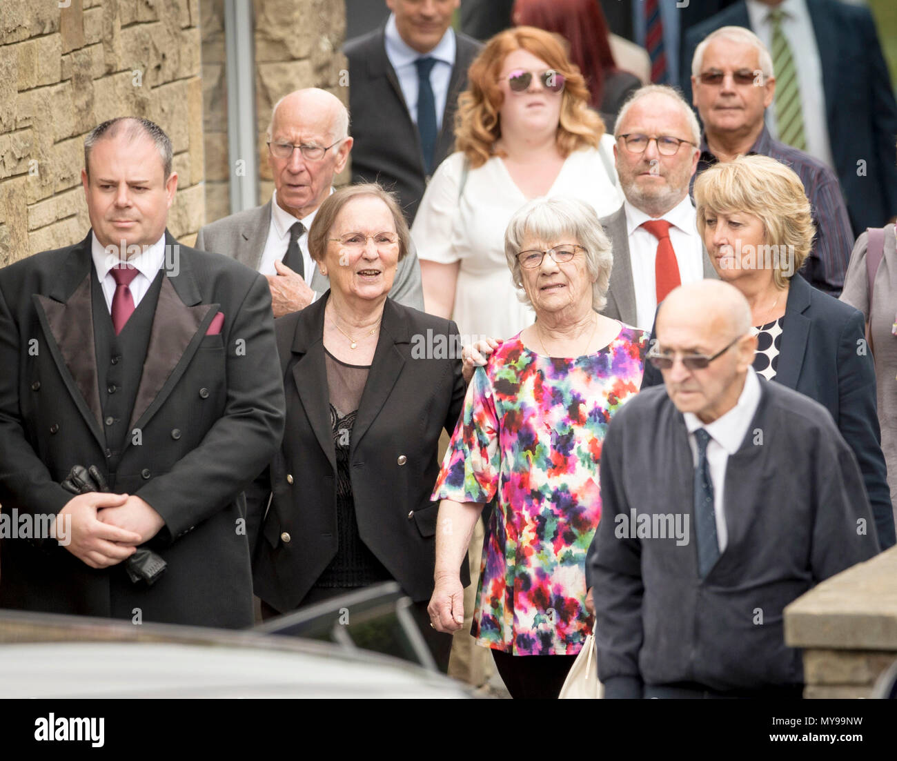 Widow Pat Wilson (2nd right in colourful top) and Sir Bobby Charlton ...