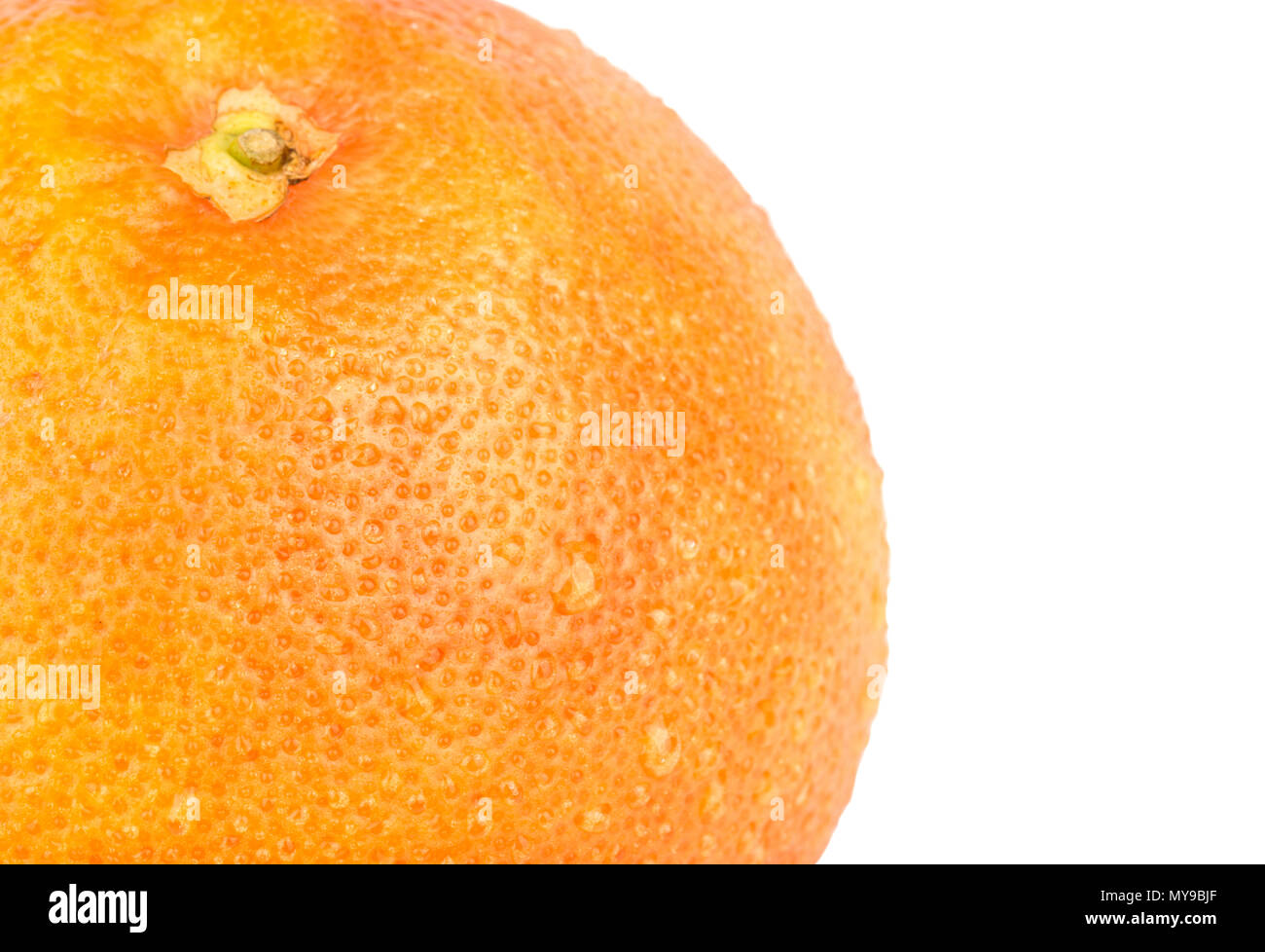 Part of ripe grapefruit with drops close-up Stock Photo - Alamy