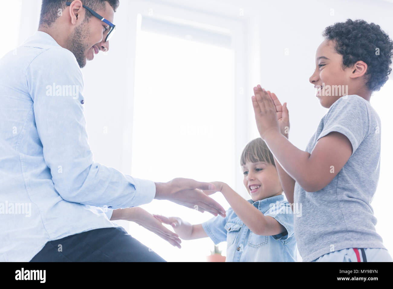 Happy children clapping classroom hi-res stock photography and images ...