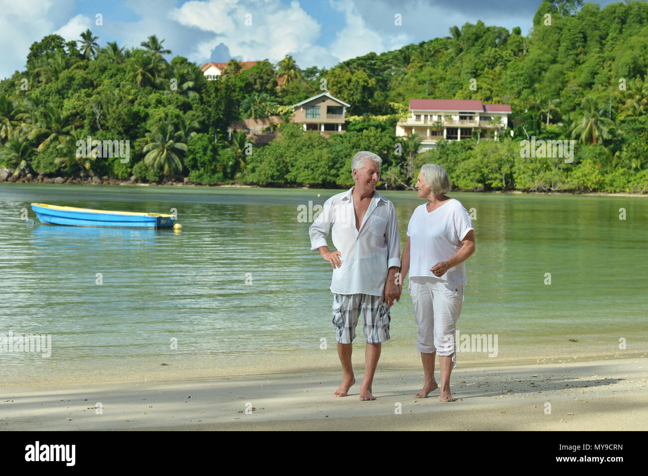 elderly couple resting on tropical resort Stock Photo - Alamy