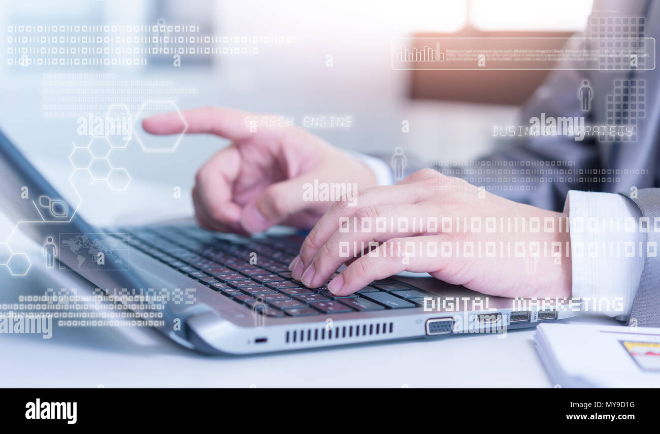 Close up of business man typing on laptop conputer with technology ...