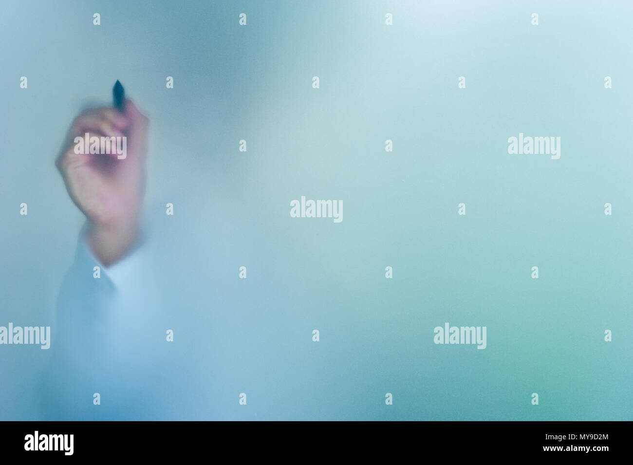 hand writing on blurred glass wall, abstract background with space ...